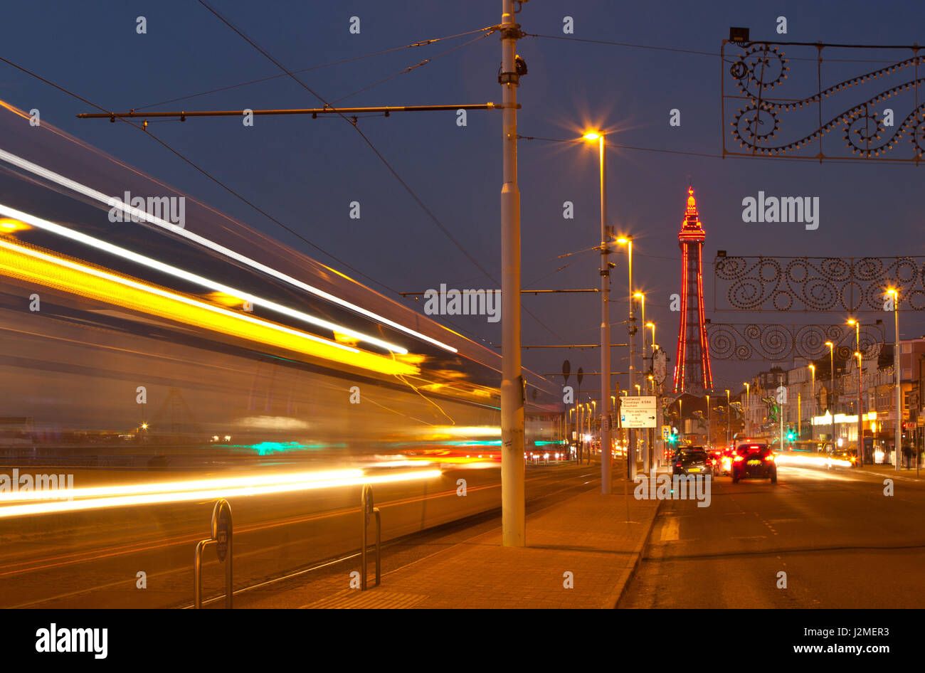 Seafront scene at Blackpool. Moving tram and The iconic Blackpool tower ...
