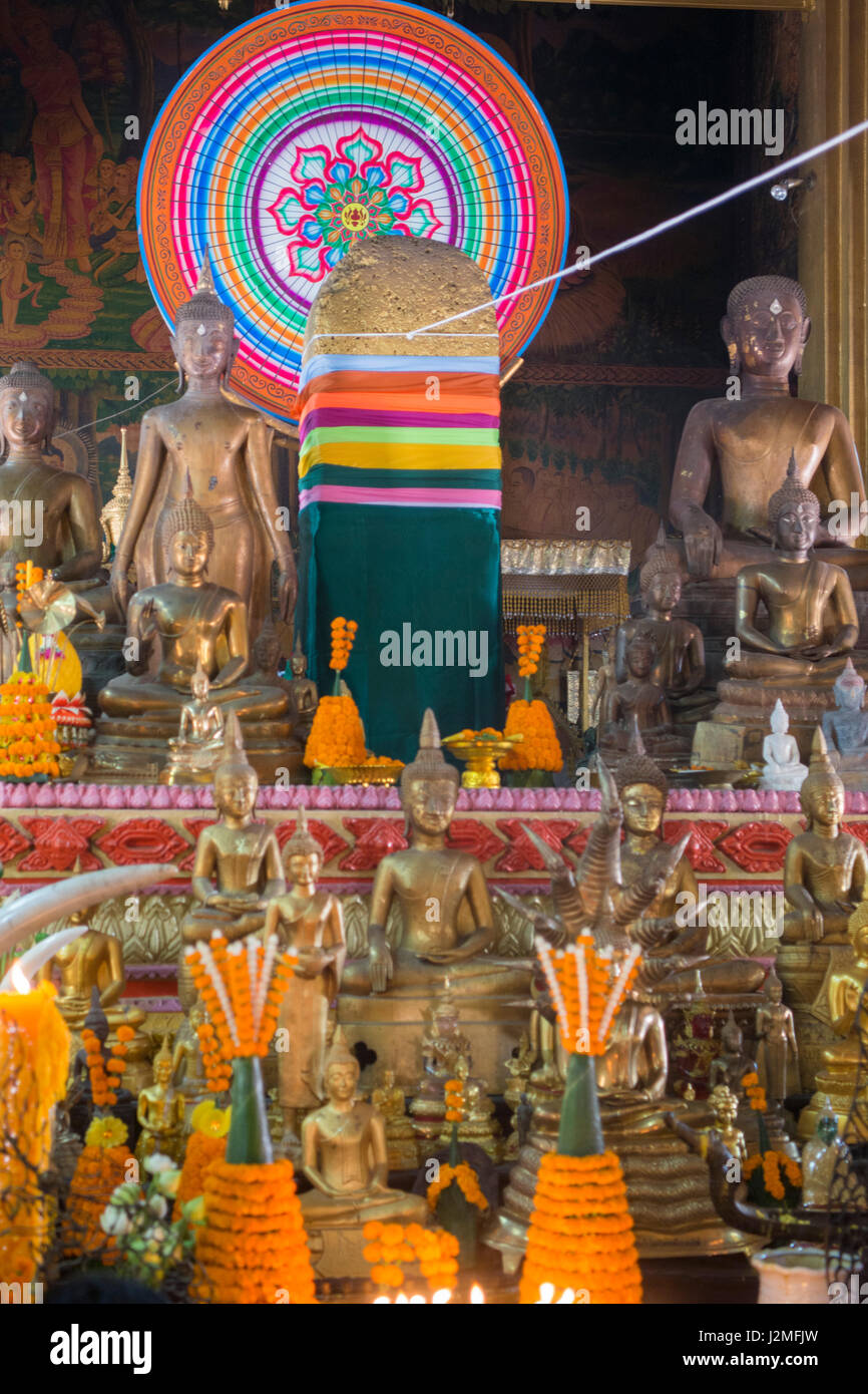 People at a ceremony at the Wat Si Muang Temple on the That Luang ...