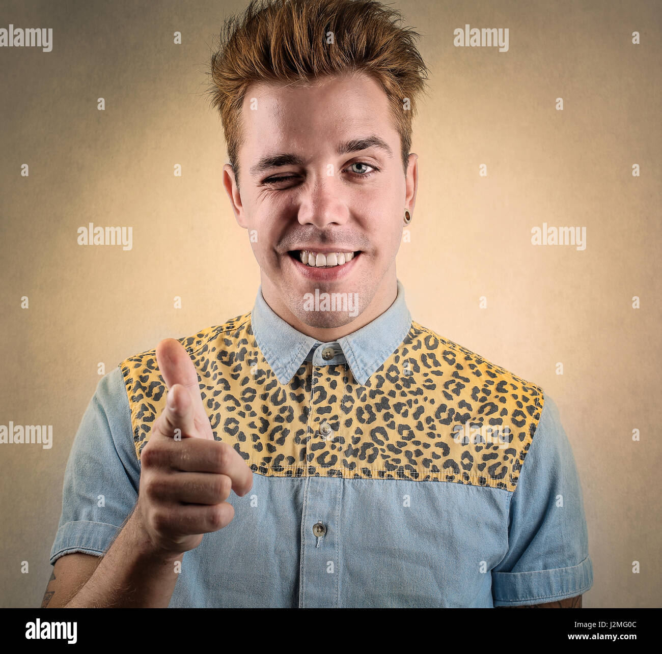 Stylish guy winking Stock Photo - Alamy
