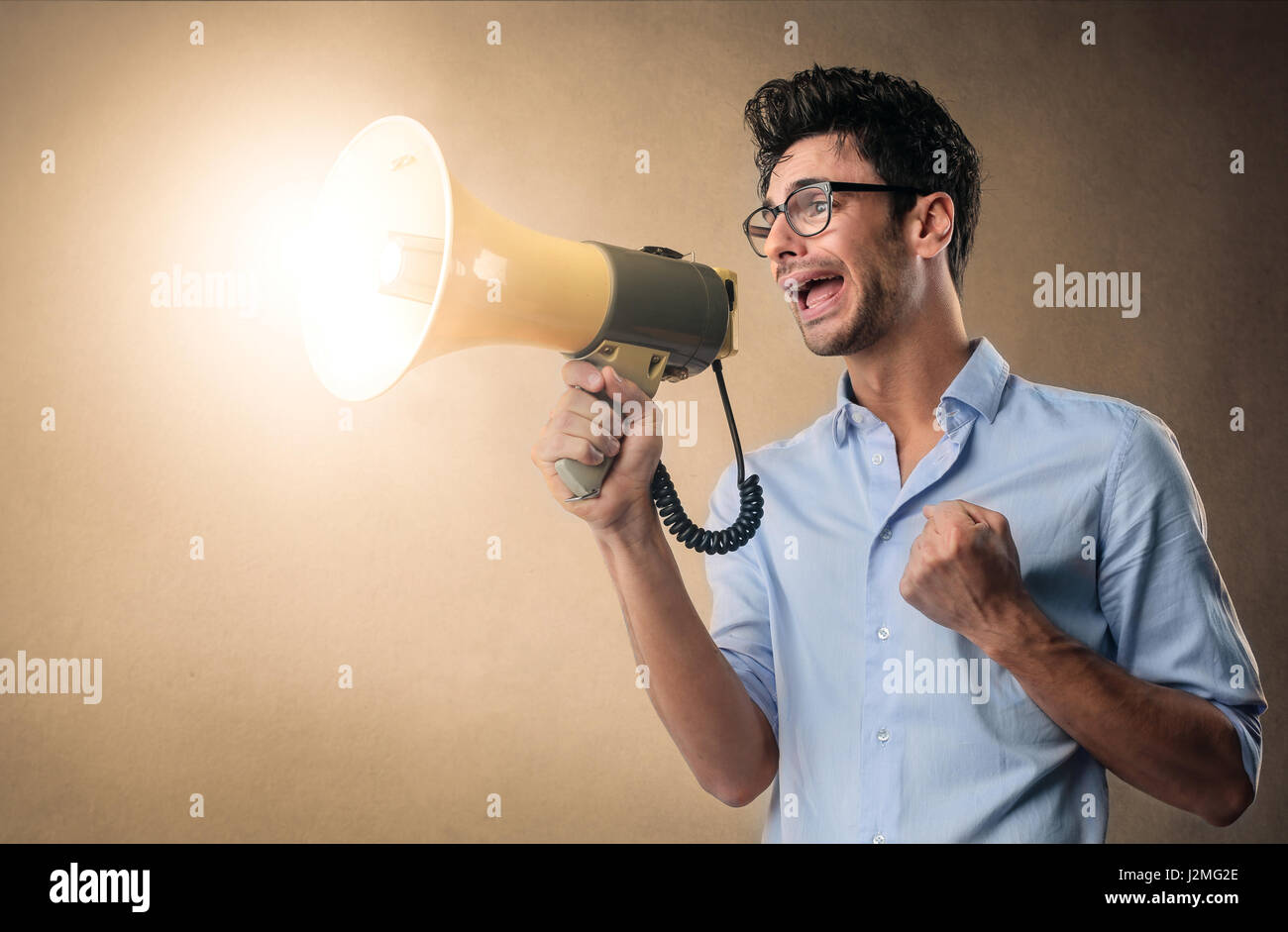 Man yelling with megaphone Stock Photo - Alamy