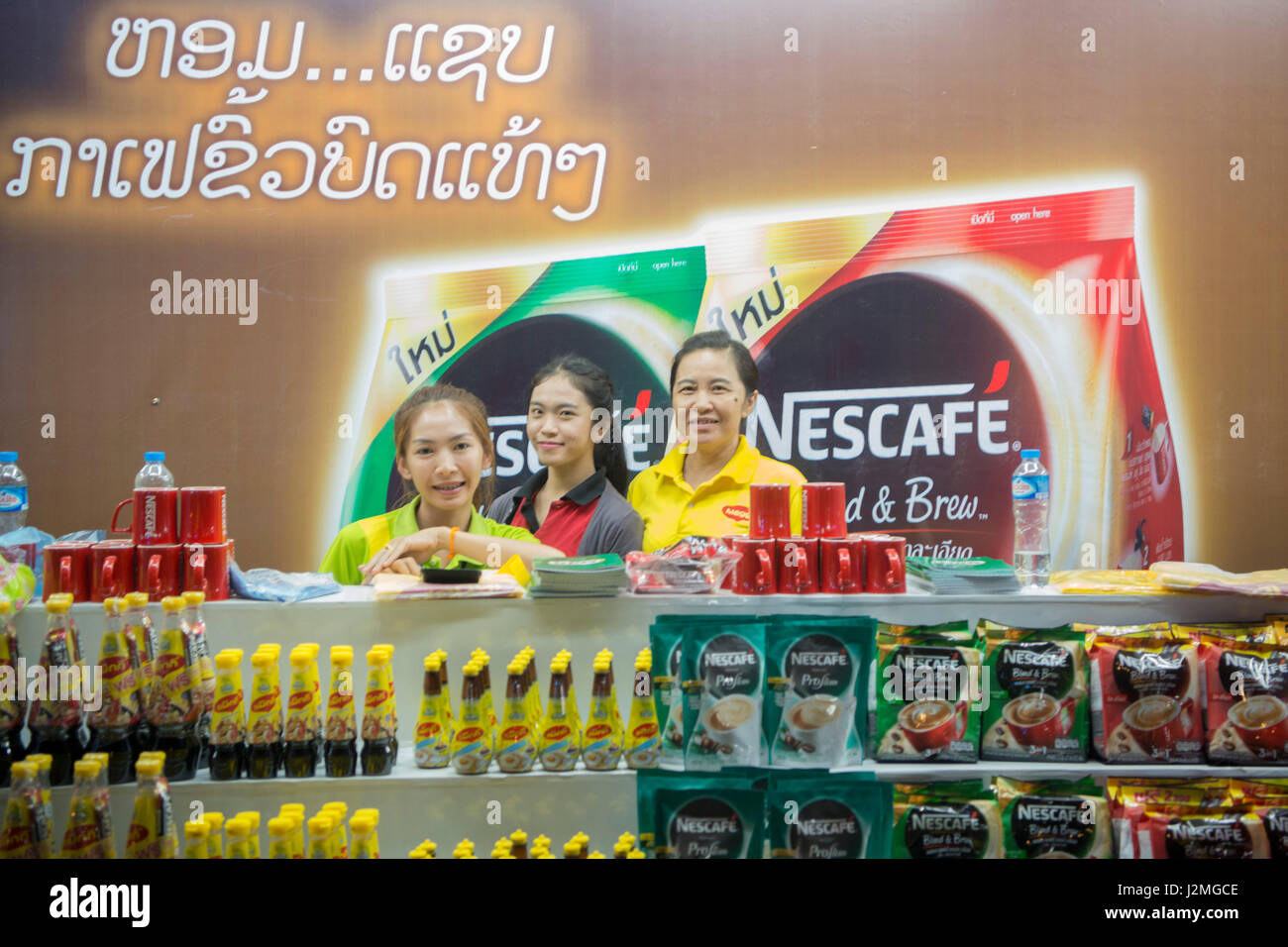 a nestle and nescafe shop at the market at the Pha That Luang Festival ...