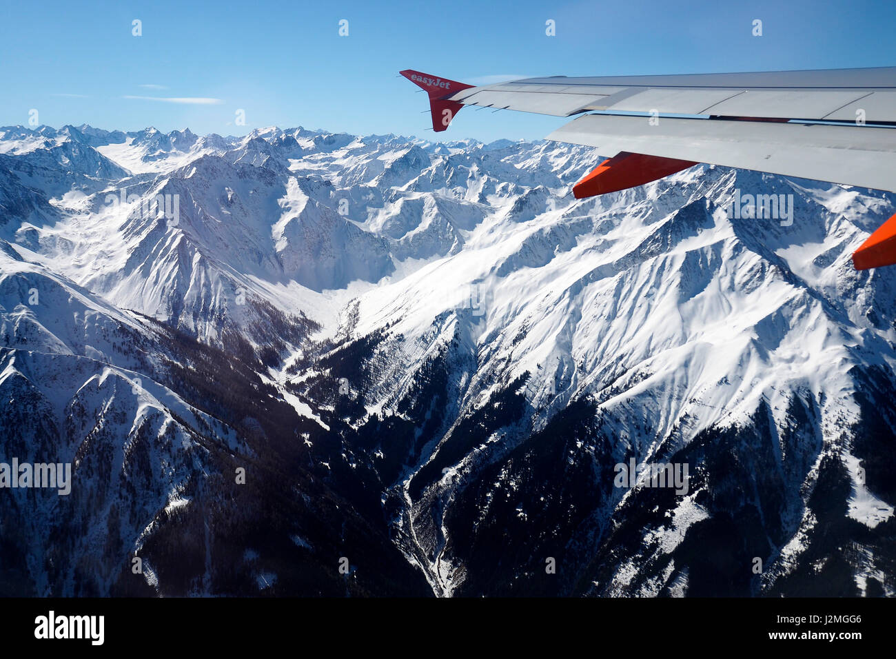 Easy Jet plane taking off over alps Stock Photo - Alamy