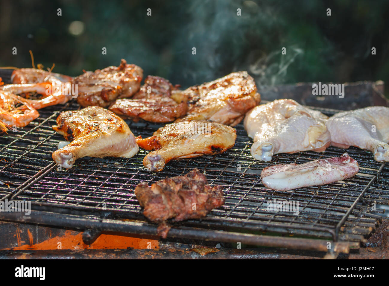 Assorted delicious grilled meat over the coals on a barbecue Stock ...