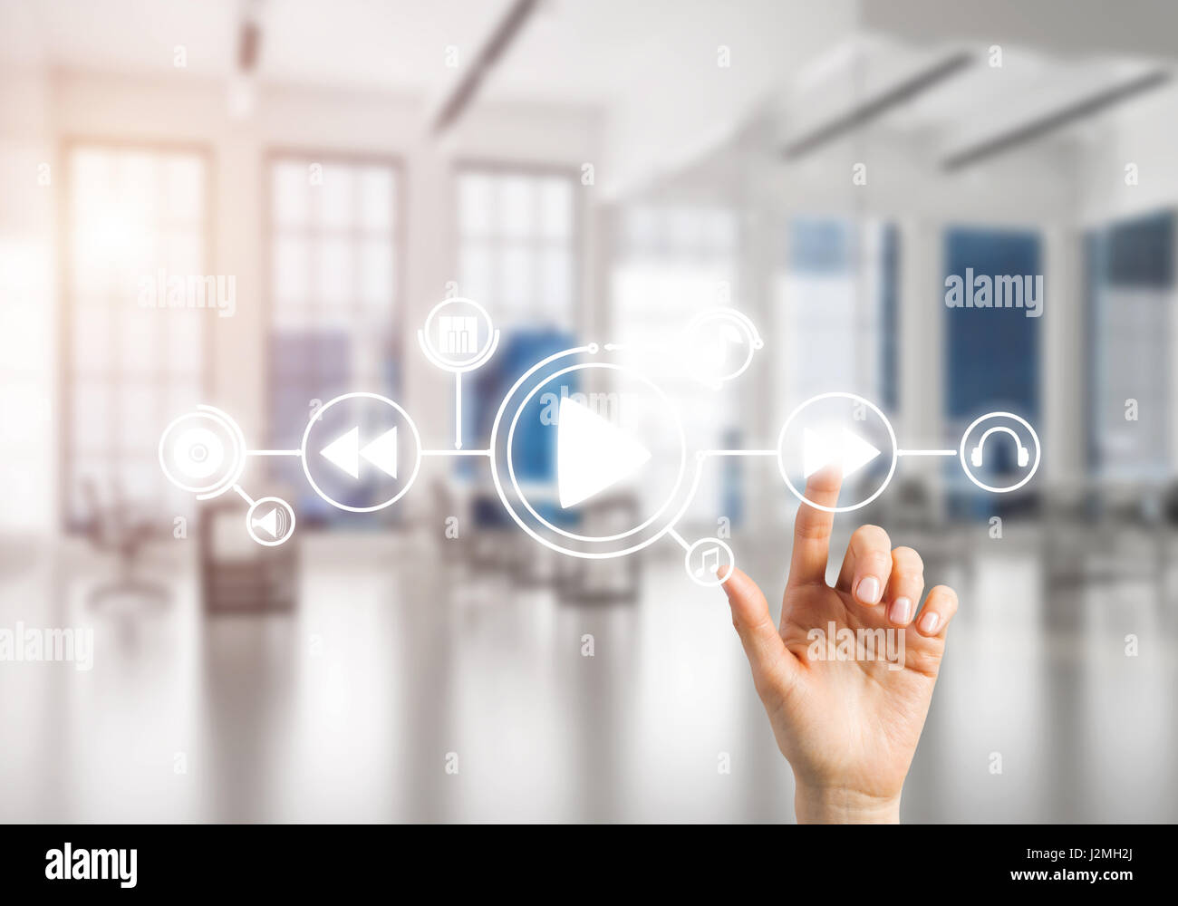 Modern office interior and close of businesswoman hand choosing symbol ...