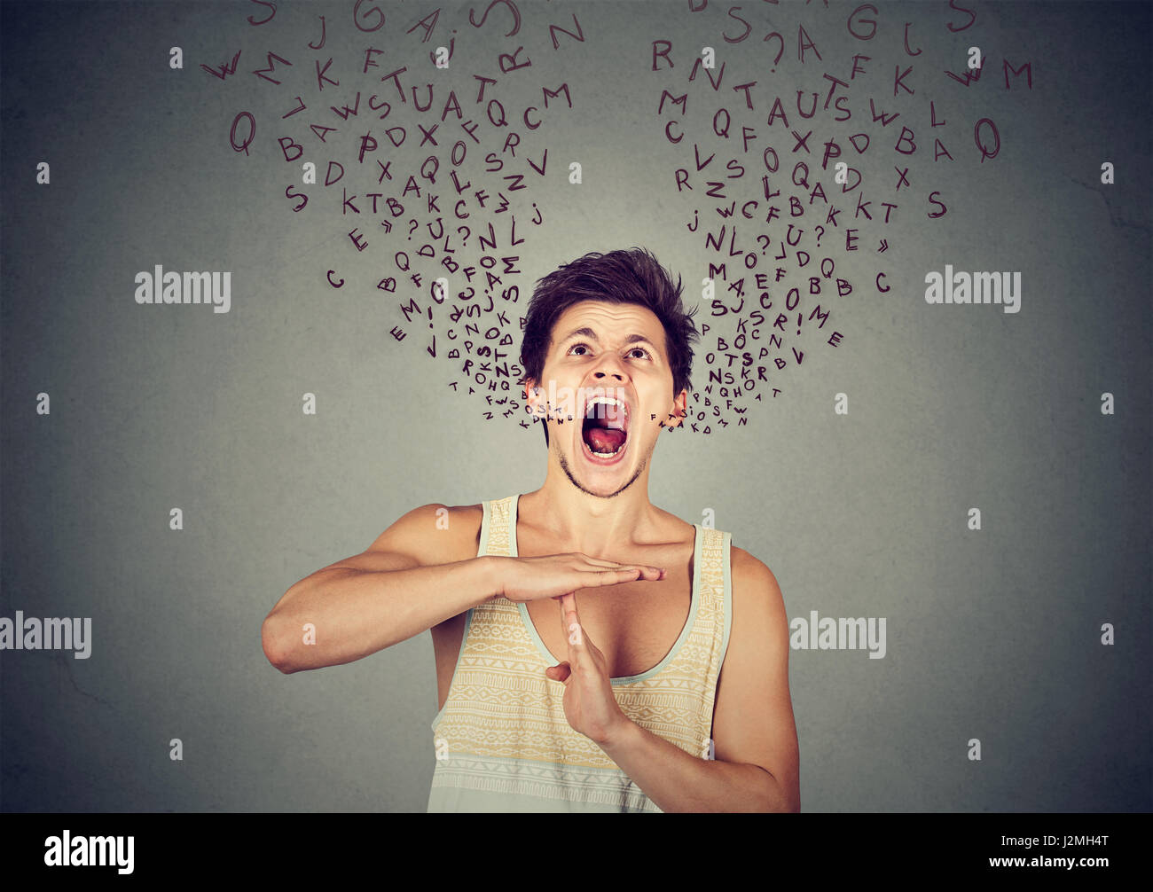 Young man showing time out hand gesture, frustrated screaming to stop ...