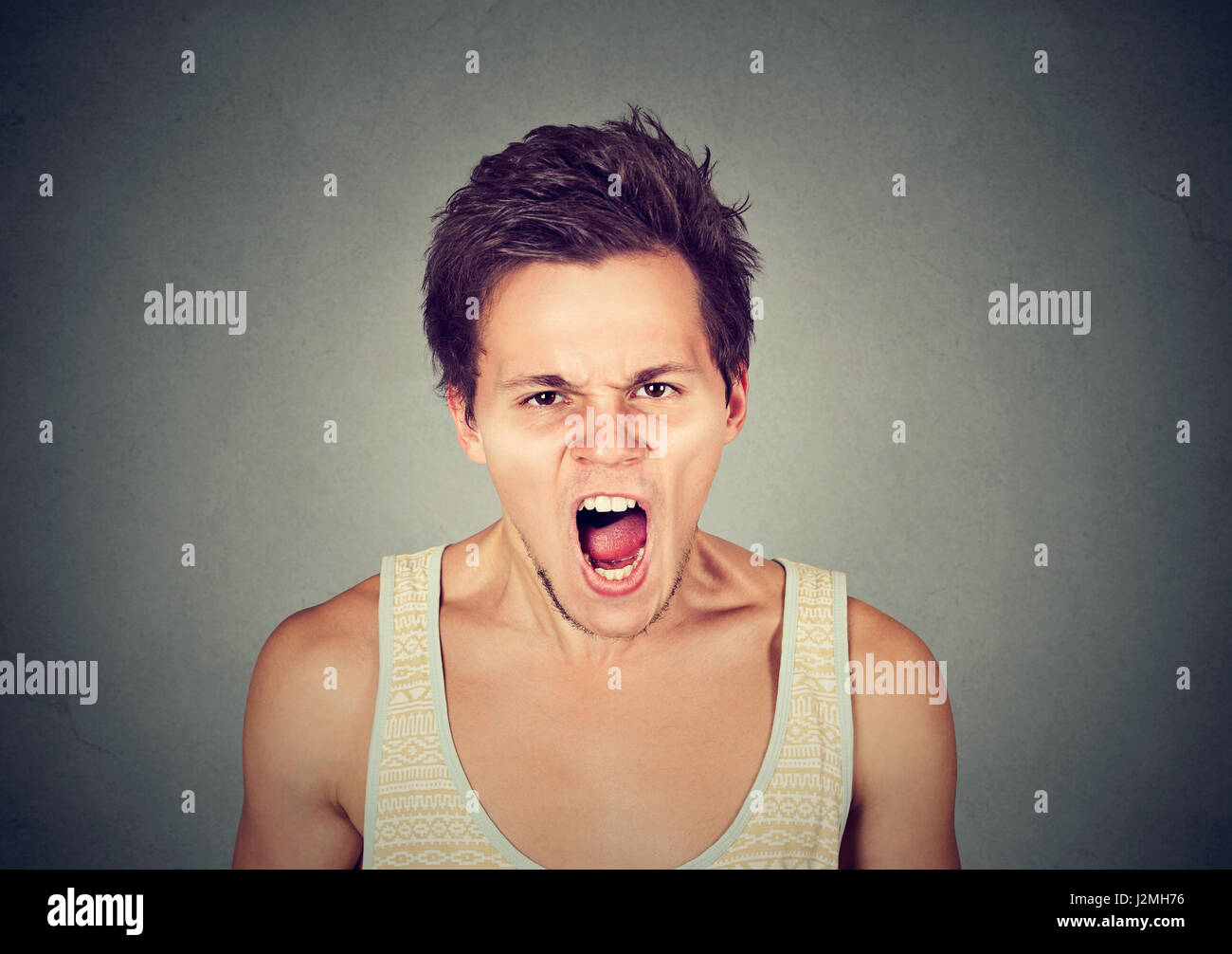 young angry man screaming Stock Photo - Alamy