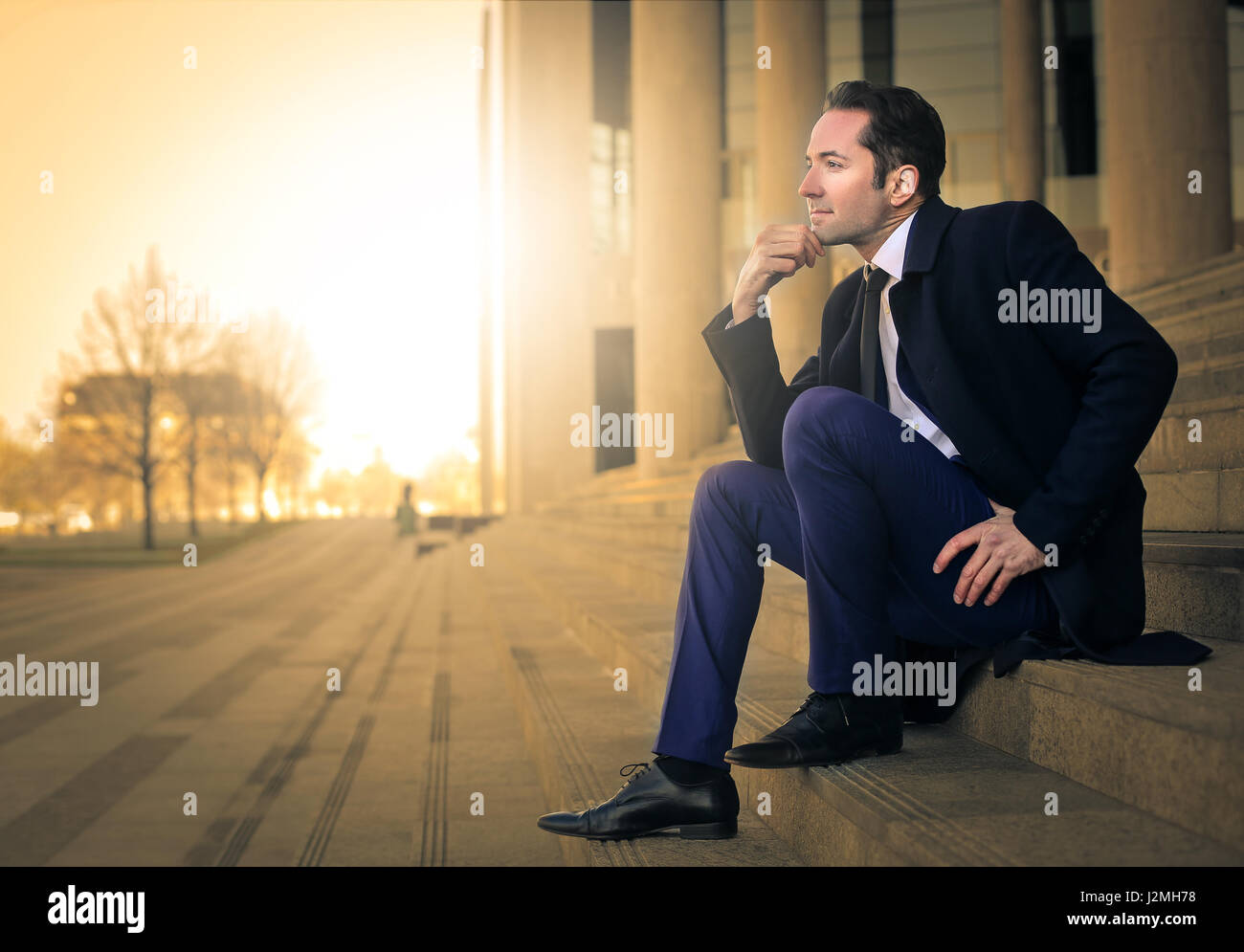 Business man back stairs hi-res stock photography and images - Alamy