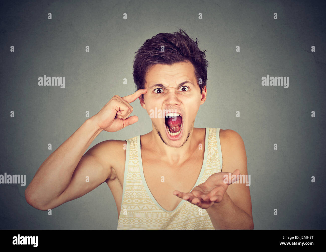 angry screaming man gesturing with his finger are you crazy? Isolated ...
