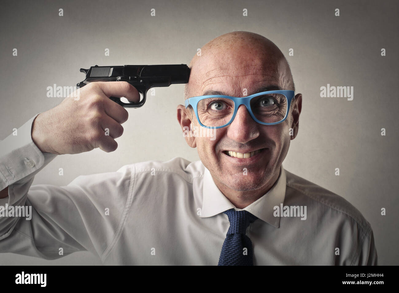 Man with gun to head business hi-res stock photography and images - Alamy