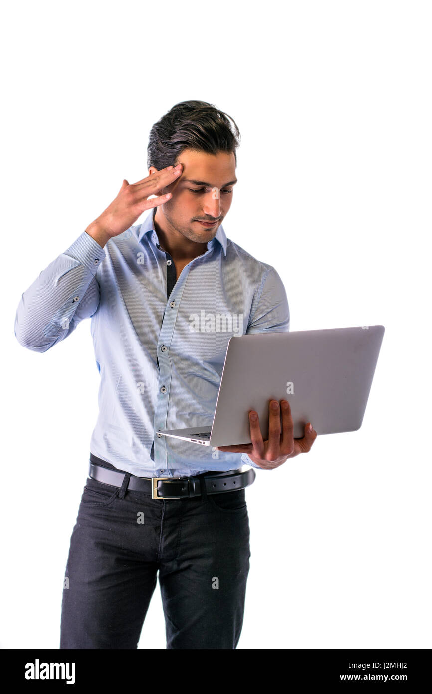 Young man working with computer standing Stock Photo - Alamy