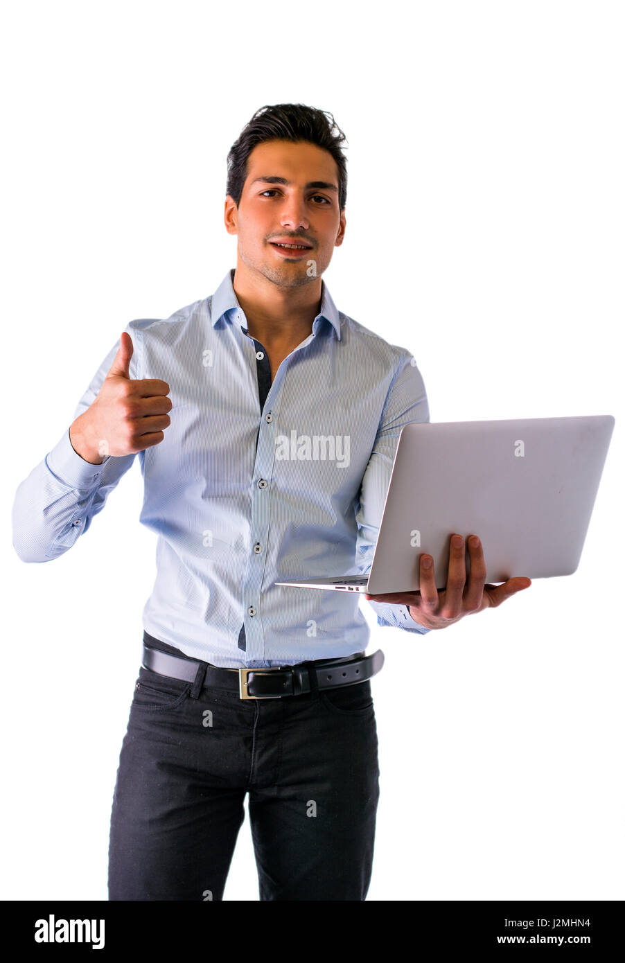 Young man working with computer with thumb up Stock Photo - Alamy