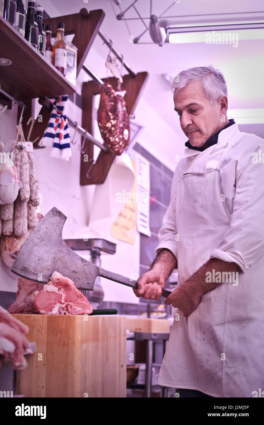 Man cutting meat hi-res stock photography and images - Alamy