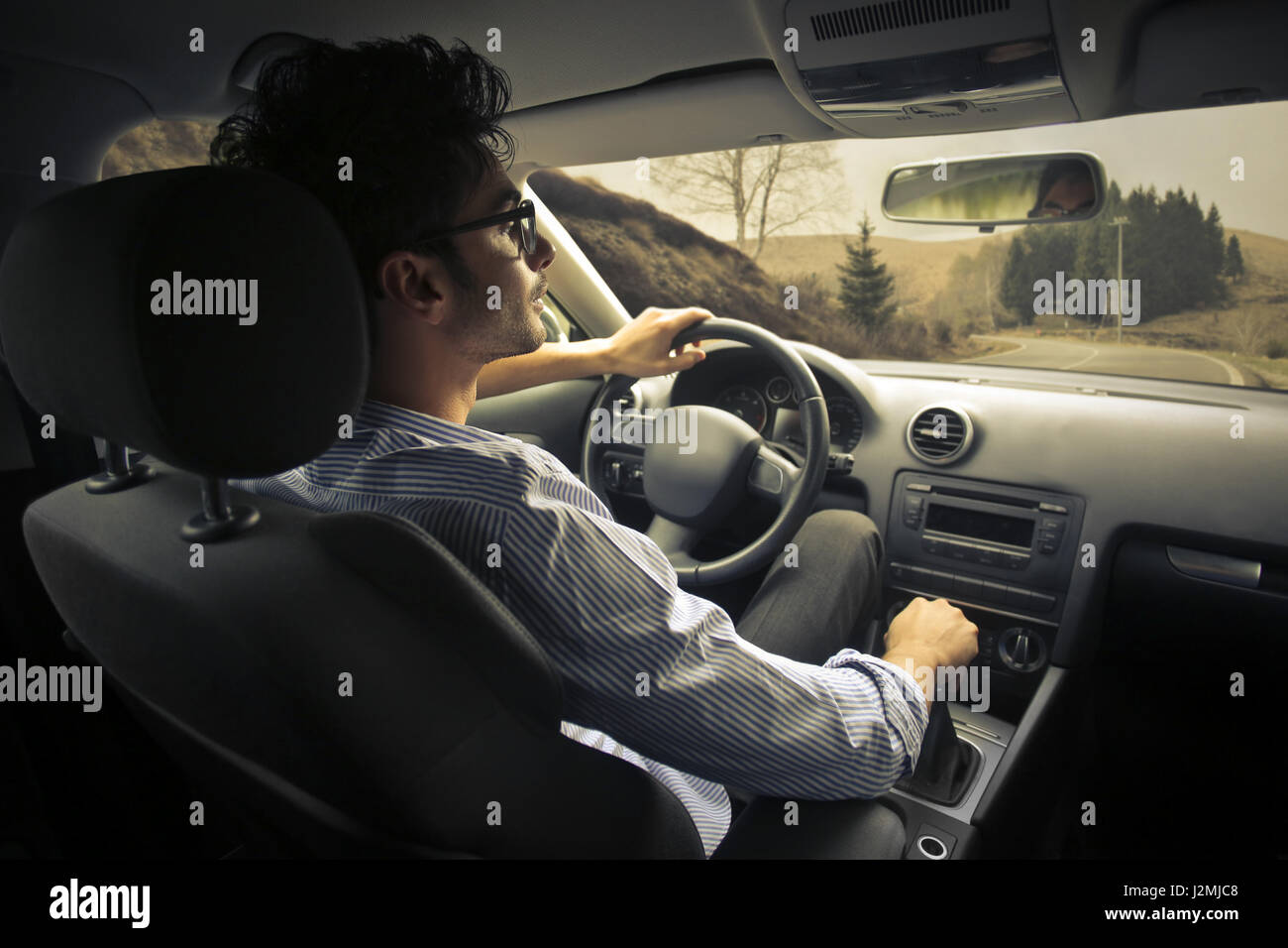 Man driving car Stock Photo - Alamy