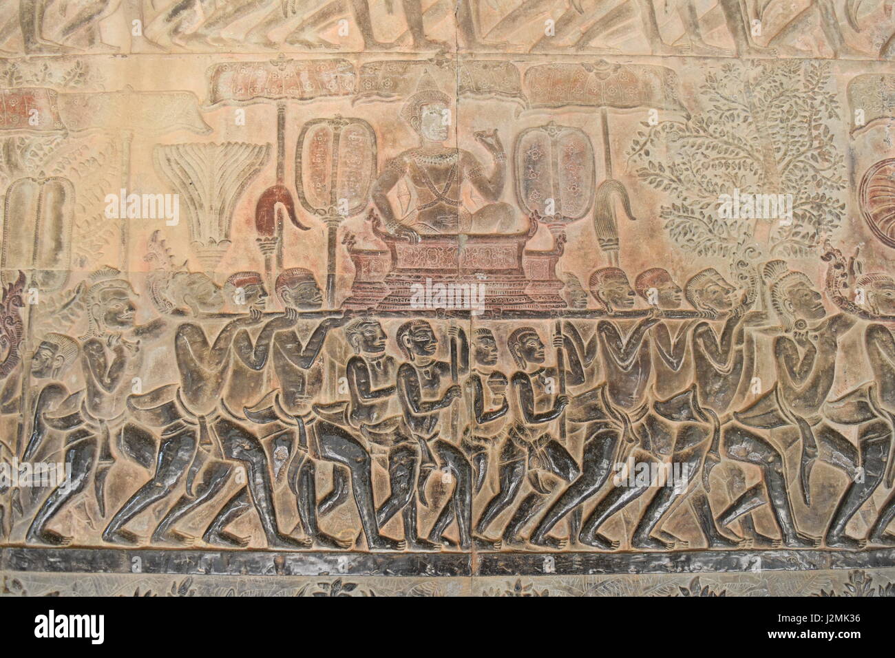 Khmer Buddhist emperor and servants bas-relief inside ancient ruins of ...