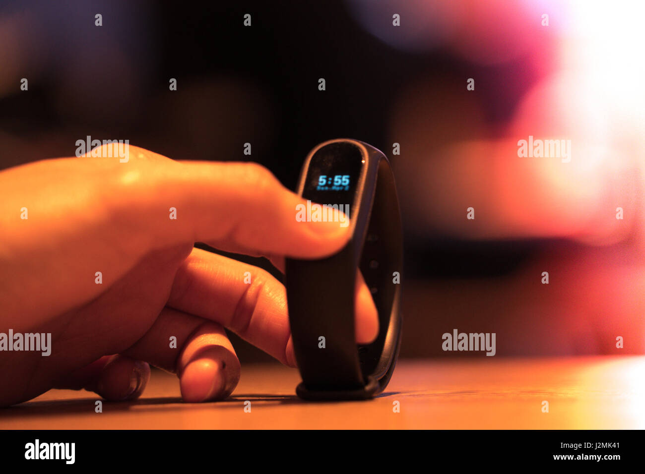 Checking info of fitness smart band device Stock Photo - Alamy