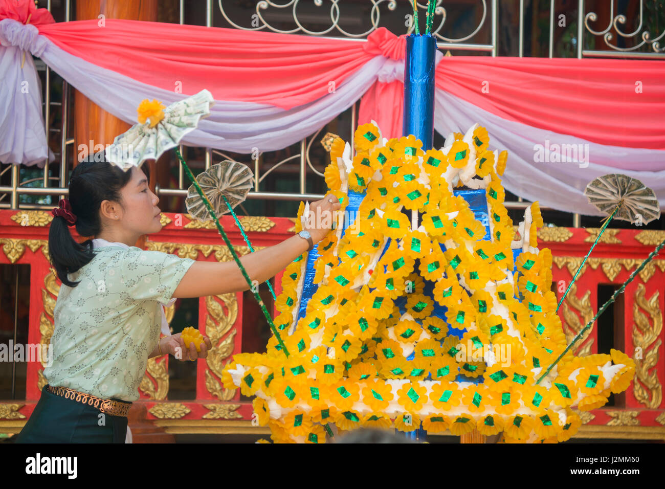 wax castle at a ceremony at the Wat Si Muang Temple on the That Luang ...