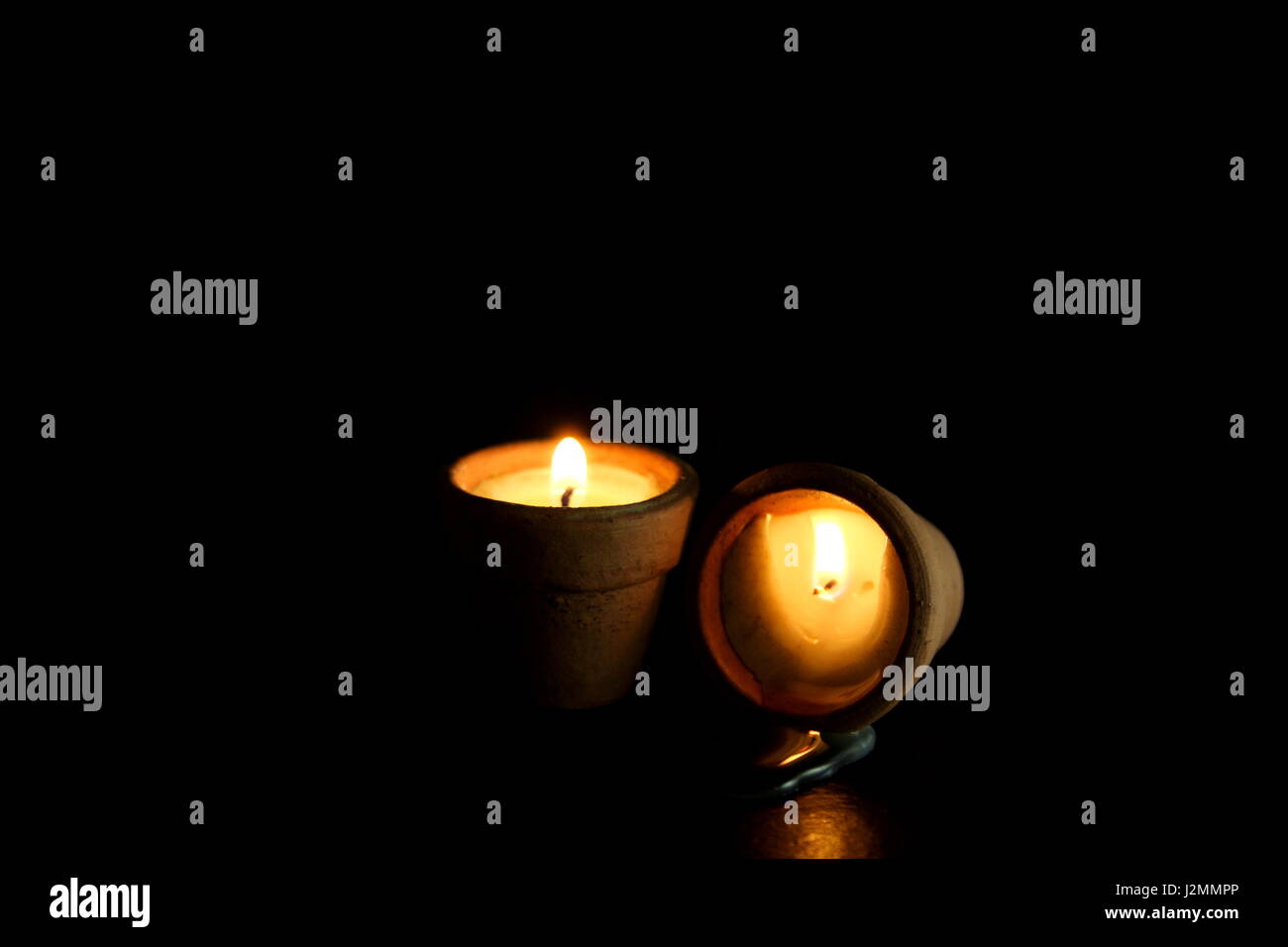 Candle Pot tipped over Stock Photo - Alamy