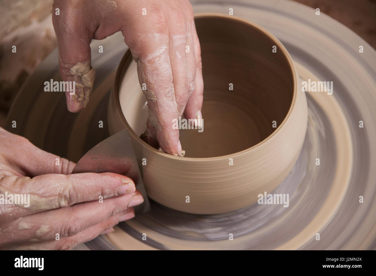 Close-up of the hands of a craftsworker ceramist molding a vase Stock ...