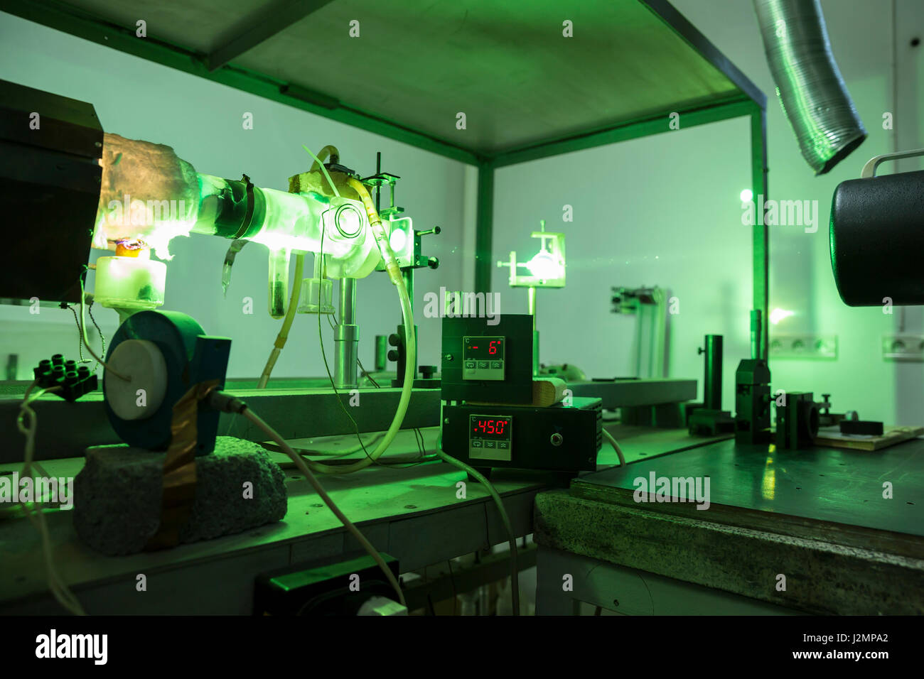 Powerful industrial green laser equipment in a laboratory for physics ...