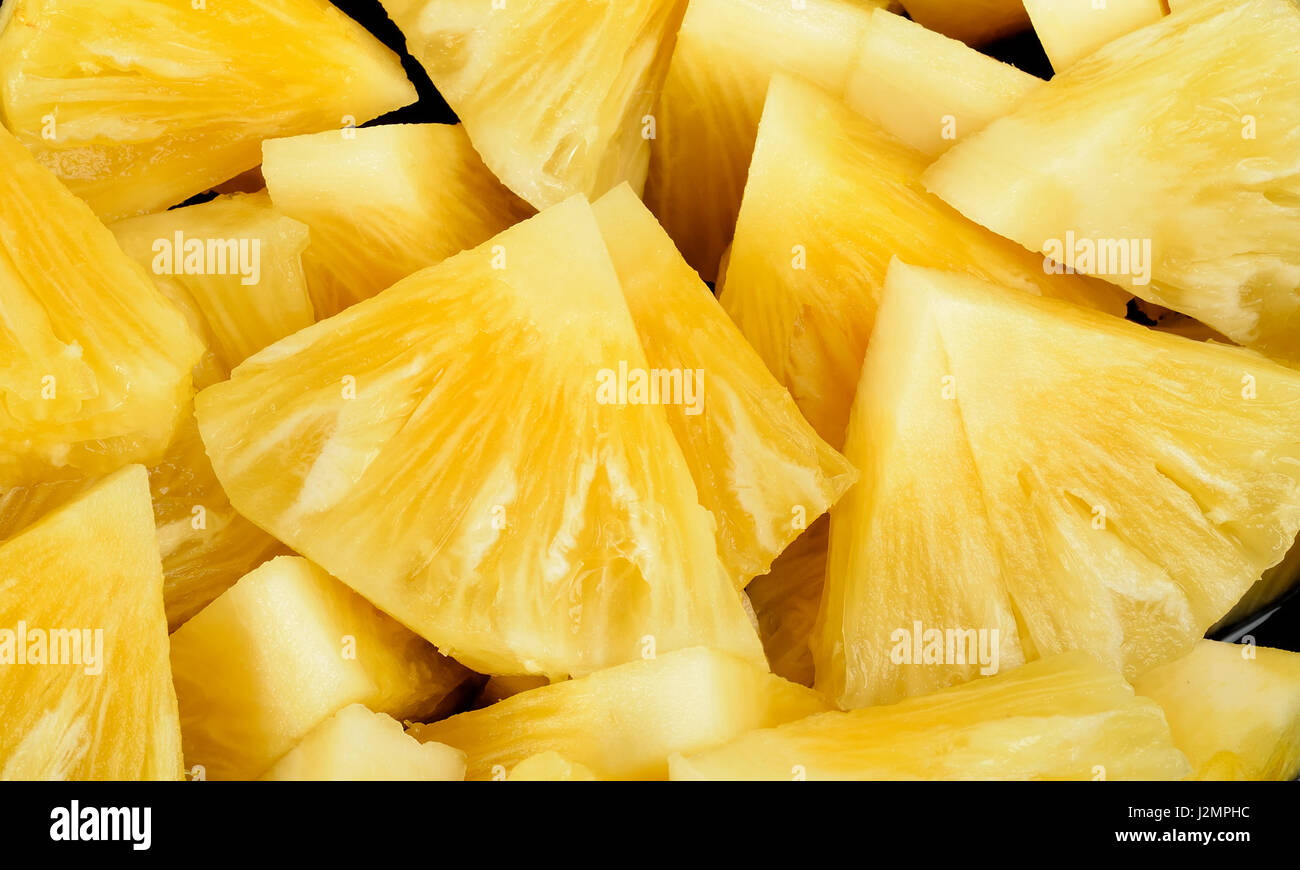 Slice of pineapple for background texture Stock Photo - Alamy