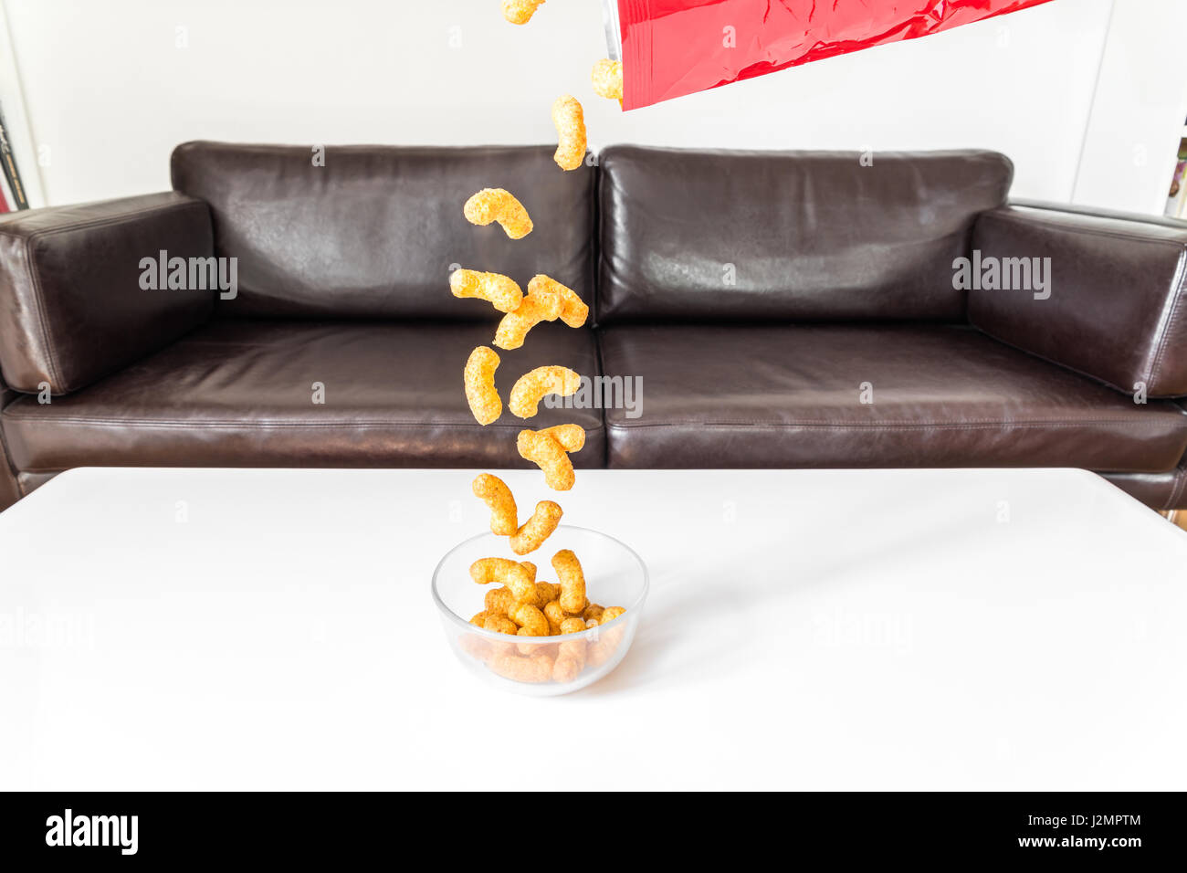 Potato chips falling on glass hi-res stock photography and images - Alamy