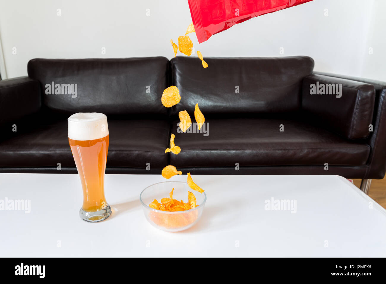 Potato chips falling hi-res stock photography and images - Alamy