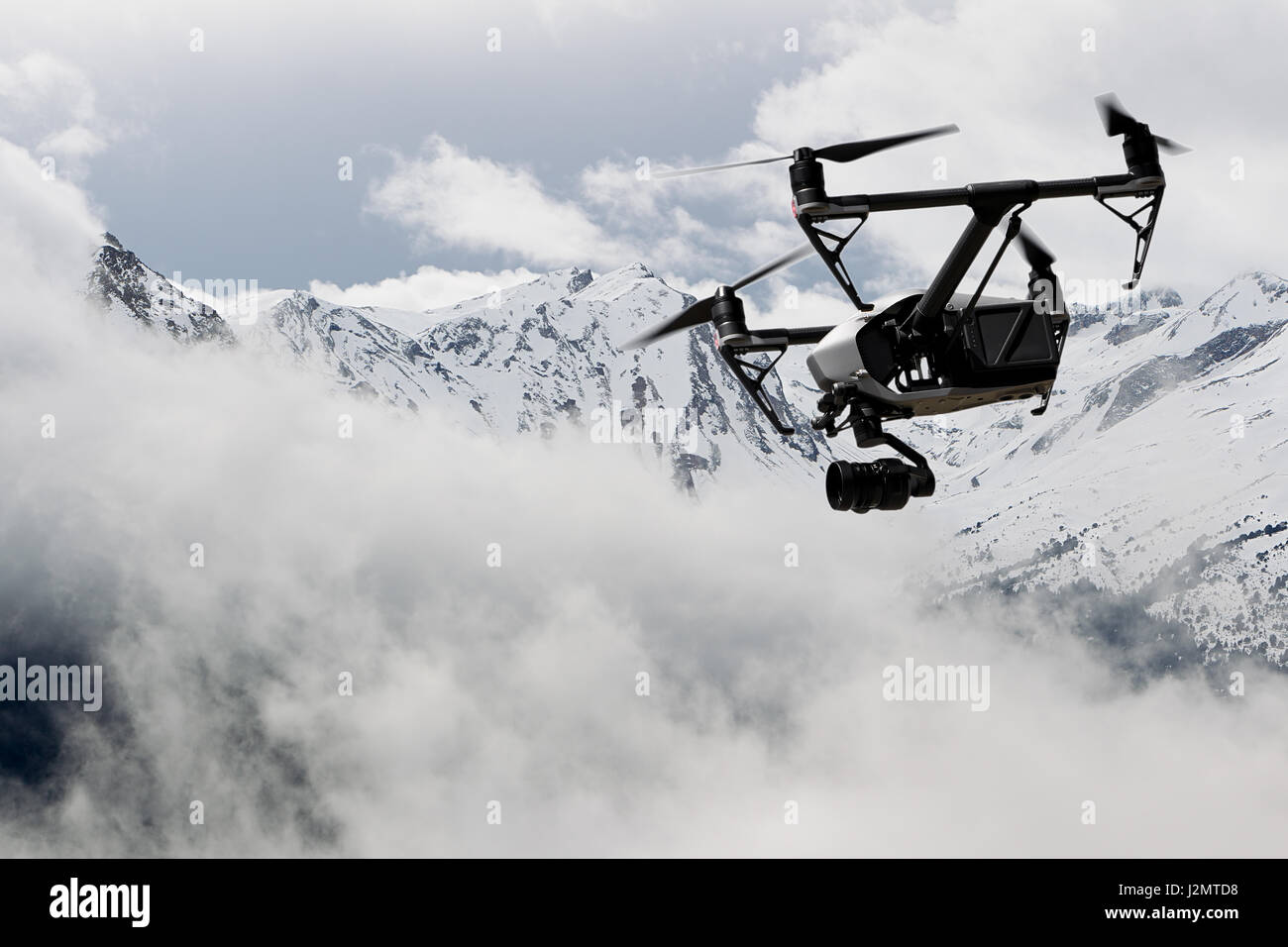 drone quad copter with high resolution digital camera flying over the ...