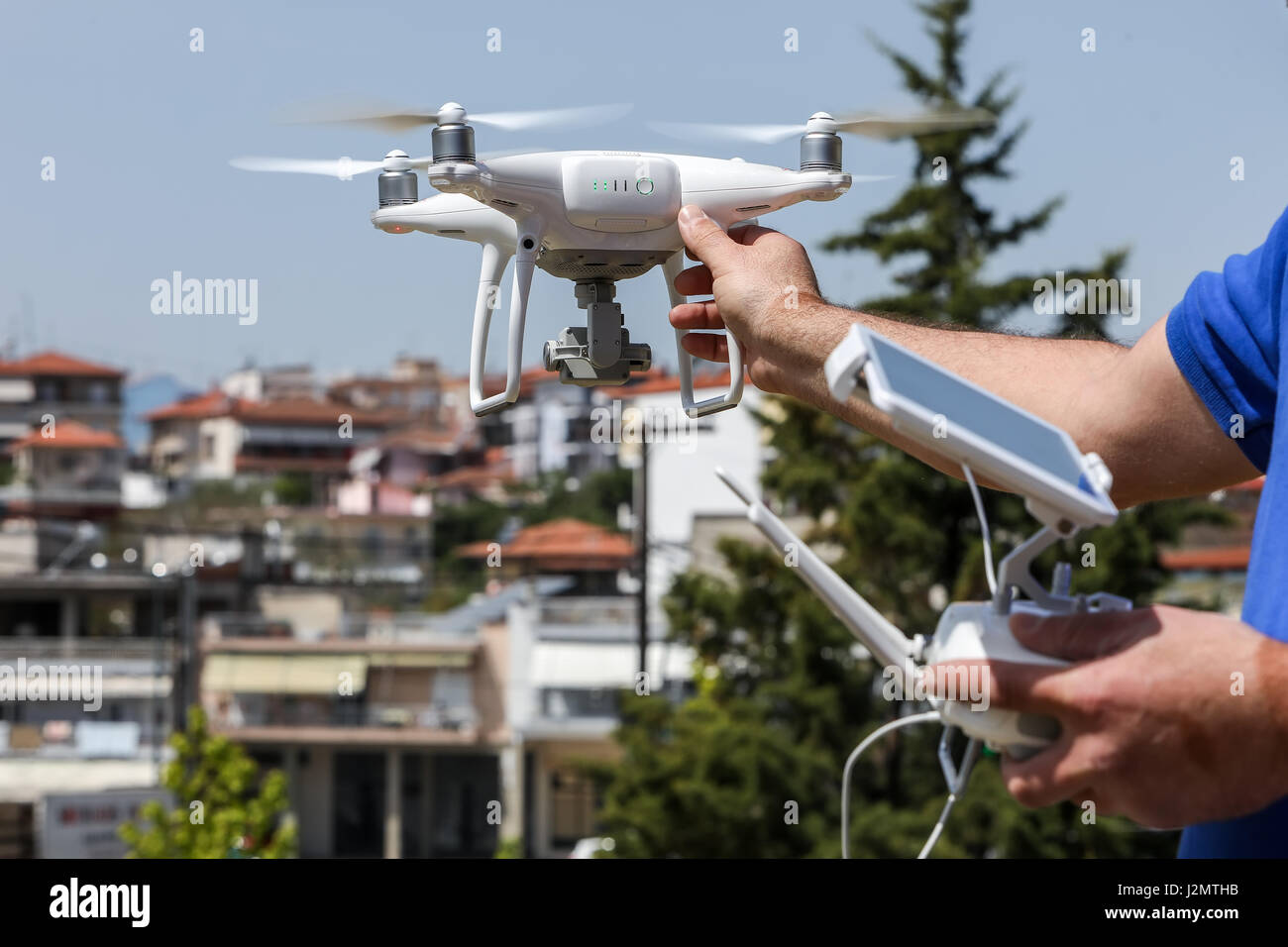 Controlling a remote helicopter drone. Drone flight remote controller ...