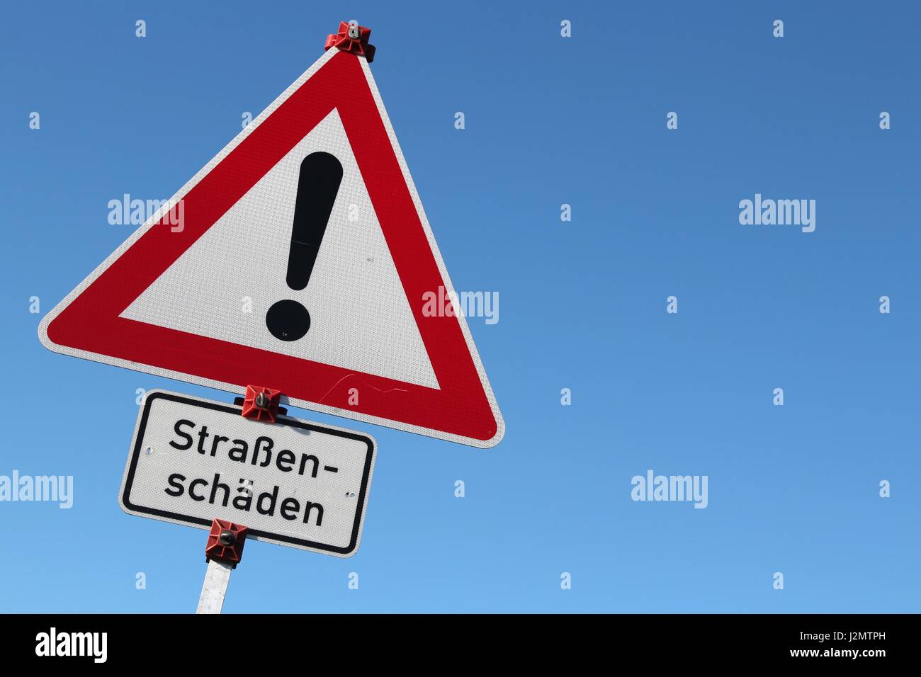 German road sign: caution - shaded road Stock Photo - Alamy
