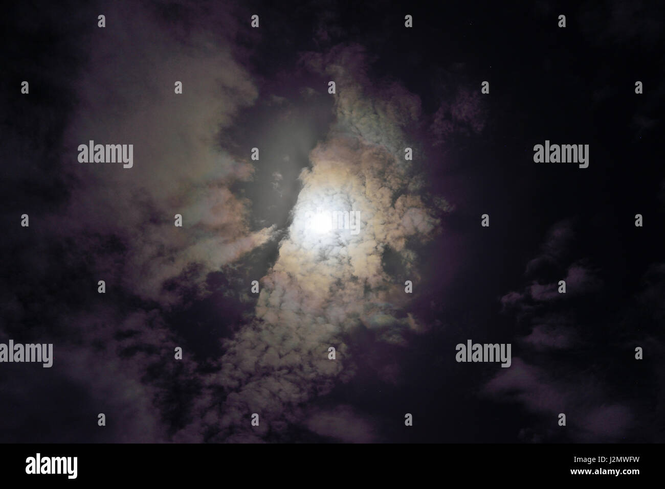 Moon shining through the clouds hi-res stock photography and images - Alamy