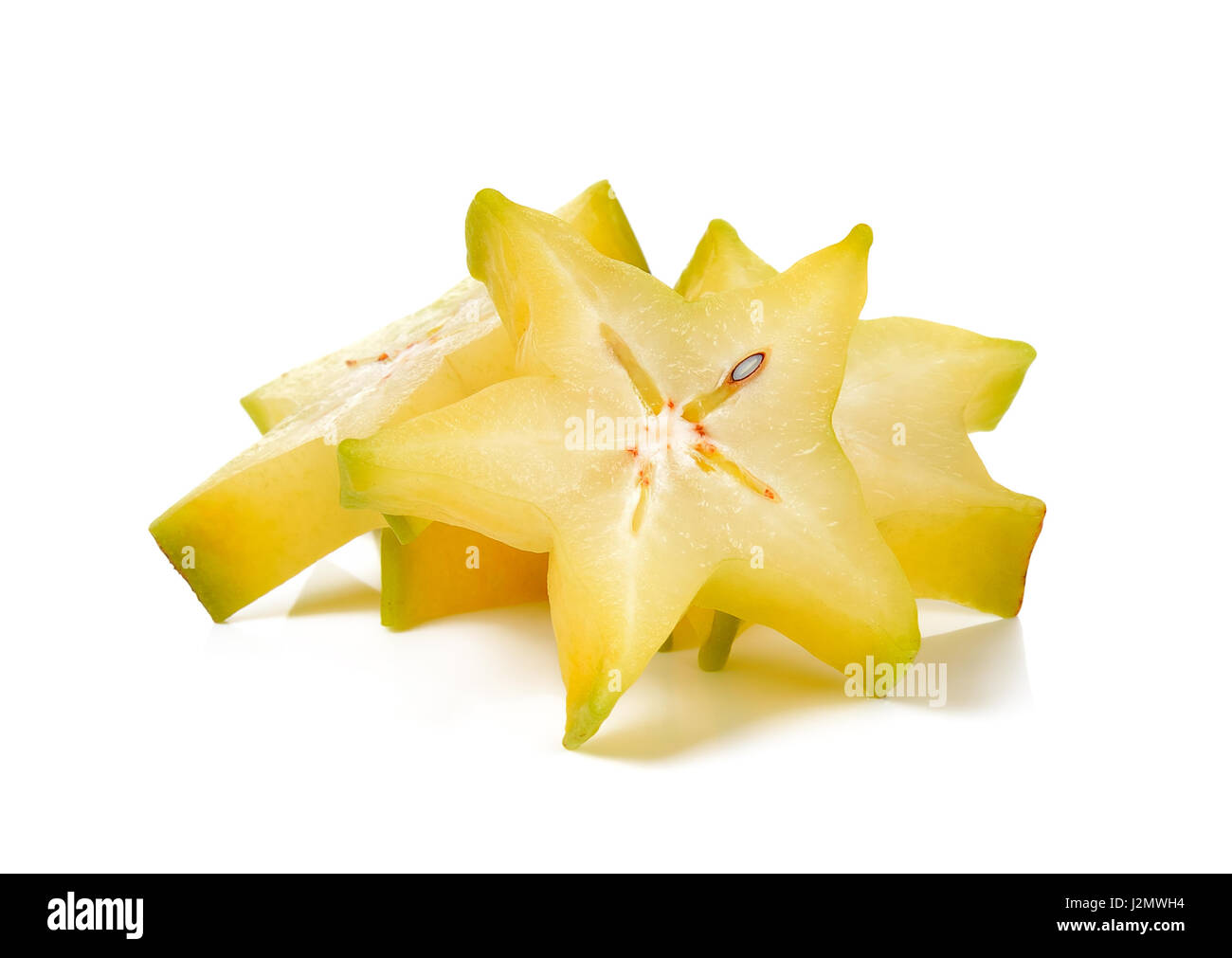 Sliced star apple isolated on the white background Stock Photo - Alamy