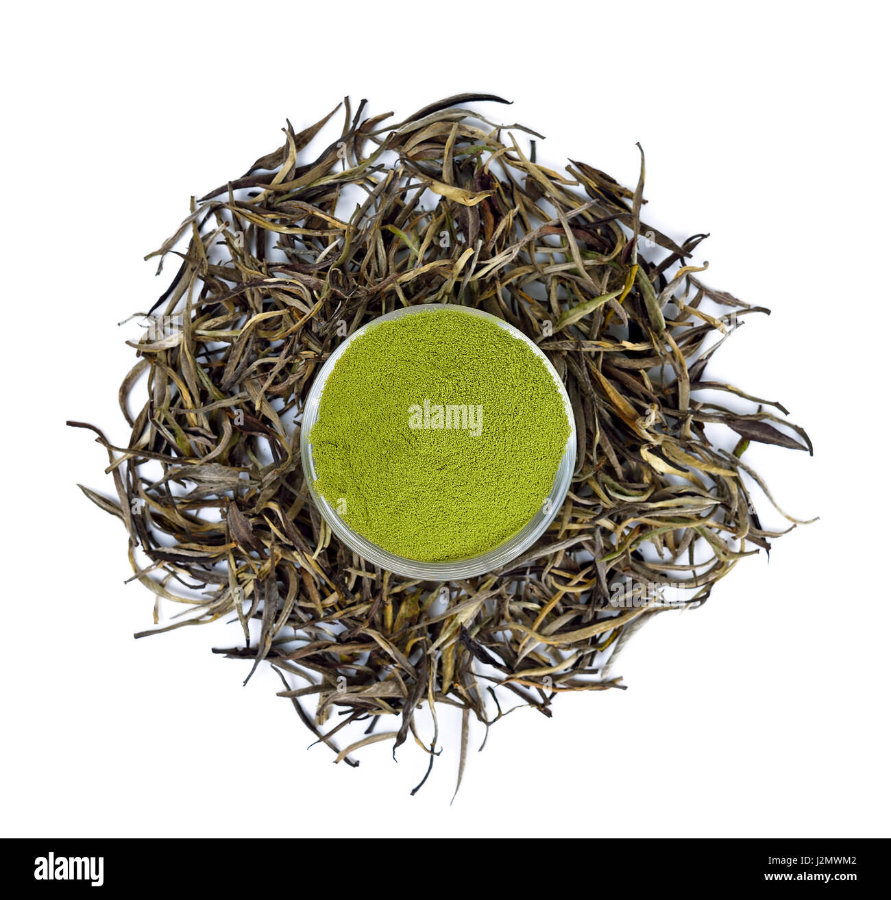 Dried tea leaf and powder with bowl isolated on white Stock Photo - Alamy