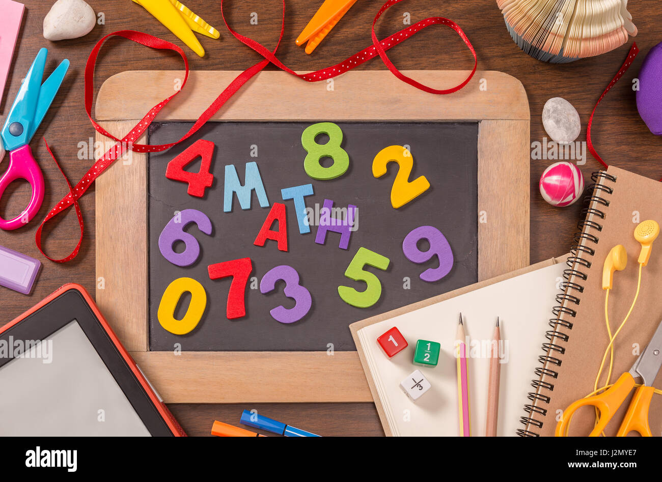 Math word formed by color wooden alphabets on small blackboard with ...