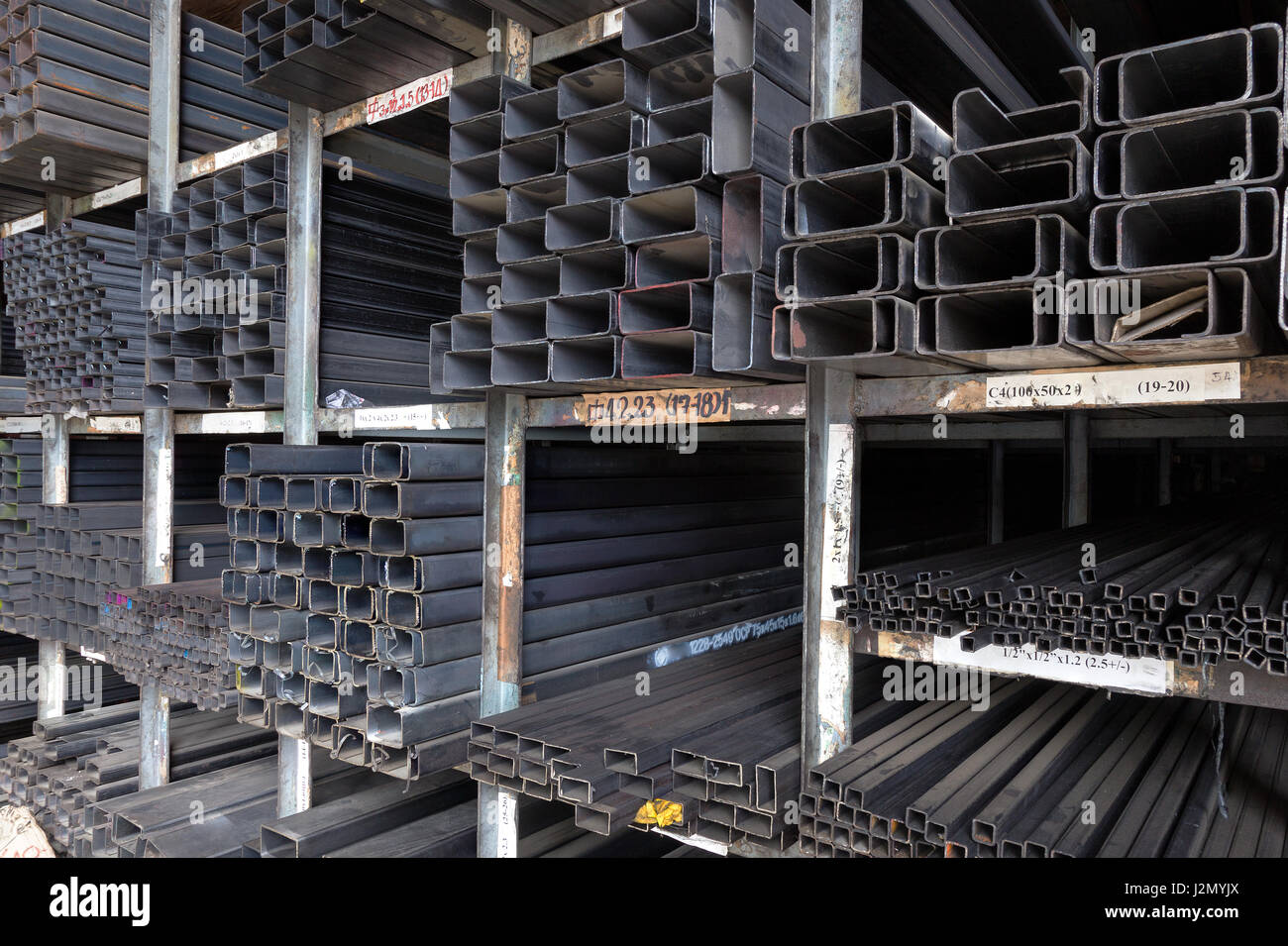 Racks of construction steel pipes in rectangle shape, various sizes ...
