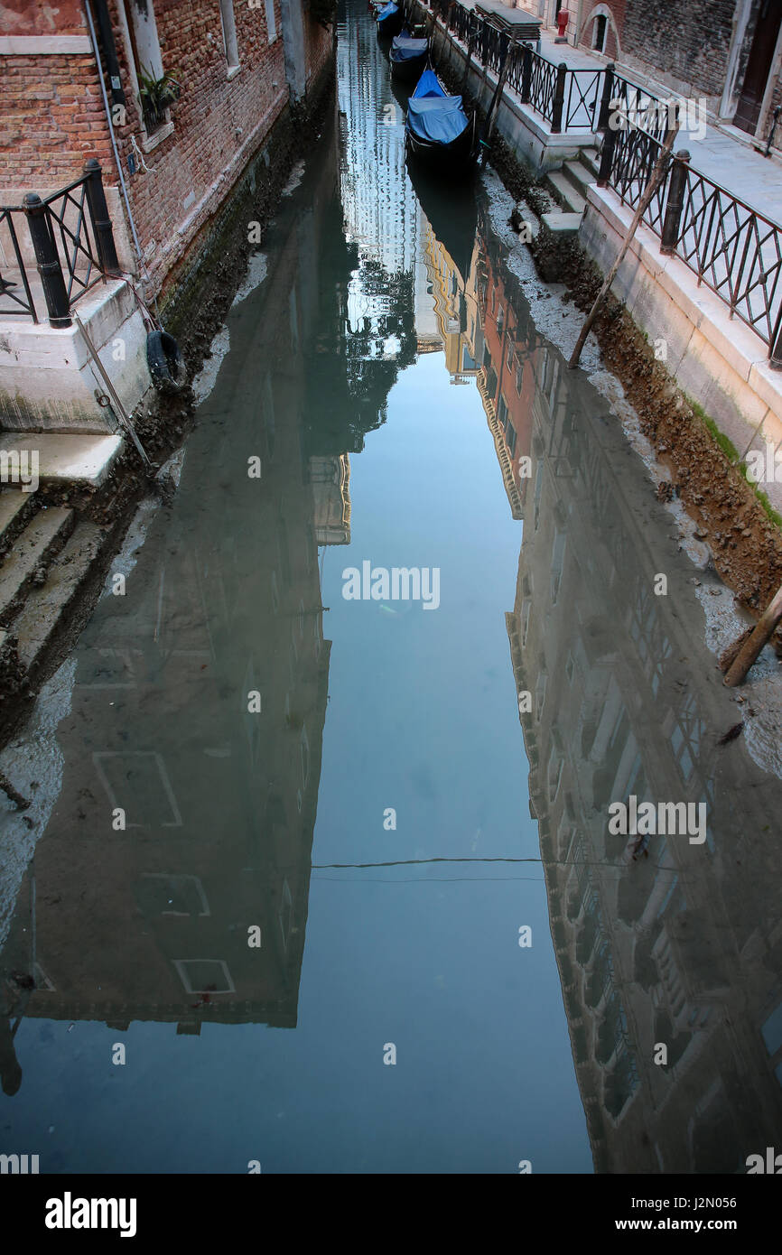 The famous canals of Venice experience a very low tide Featuring ...