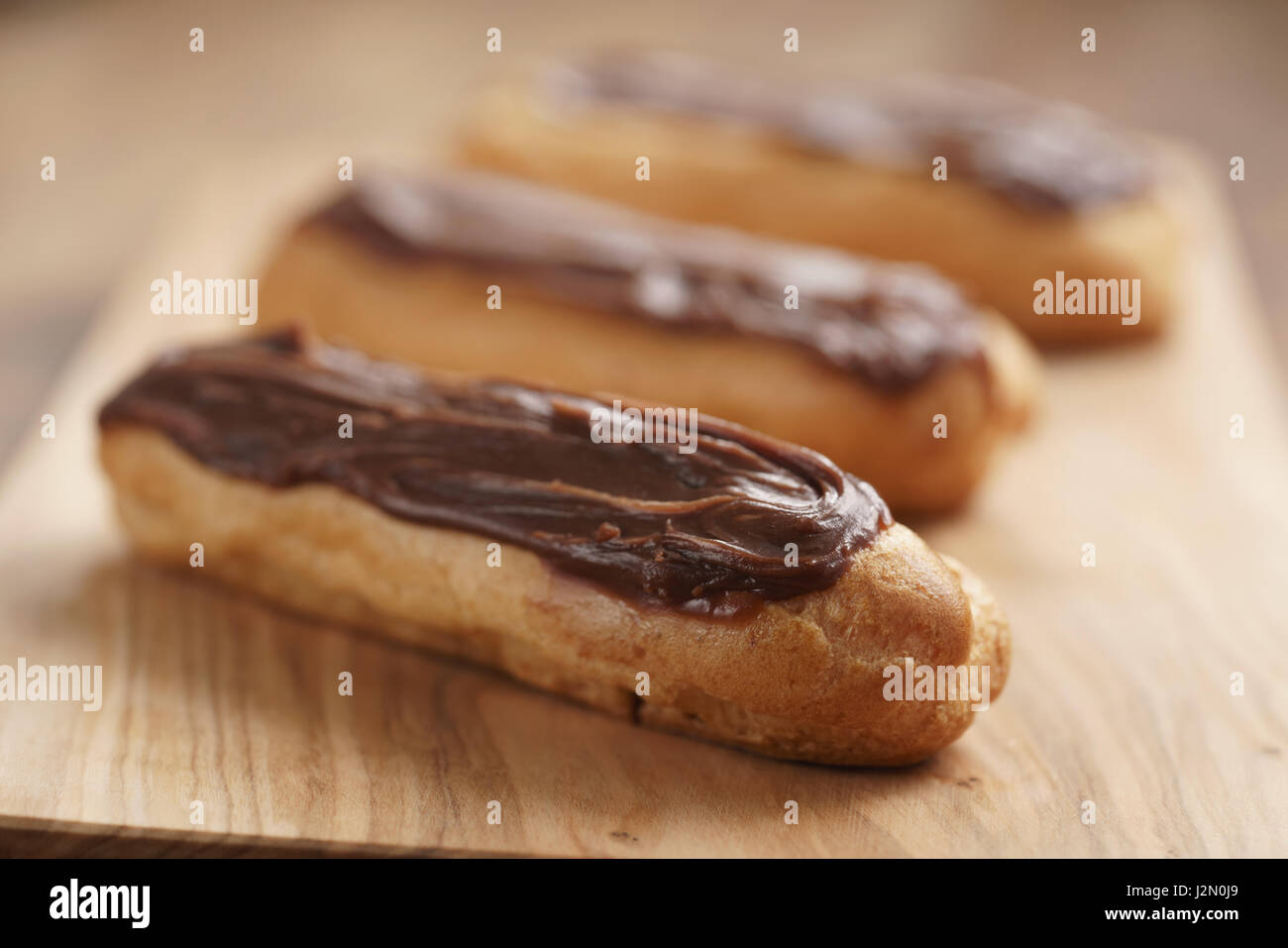 traditional french eclairs with chocolate ganache, shallow focus Stock ...