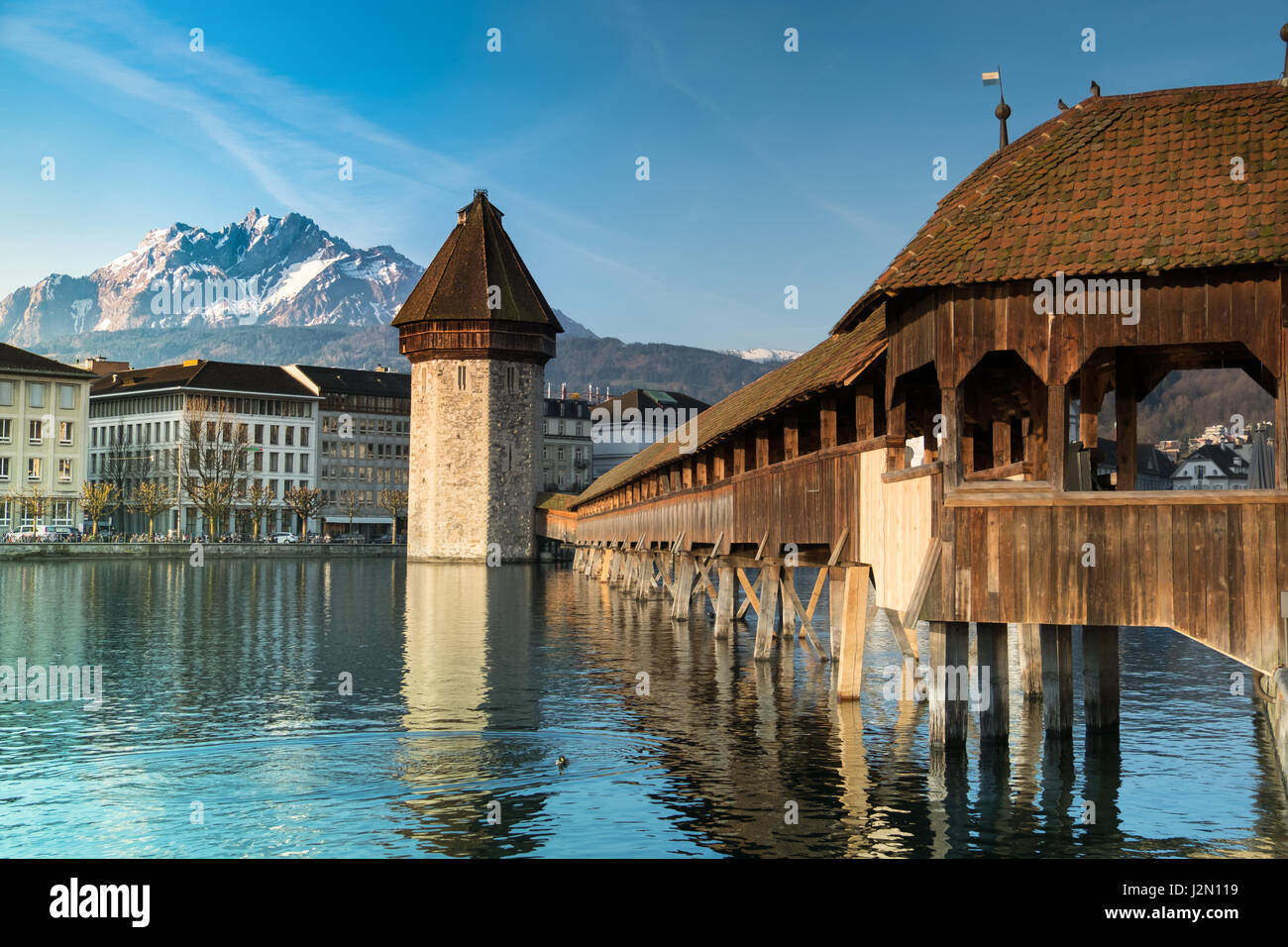 The Kapellbrücke (Chapel Bridge), a covered wooden footbridge spanning ...