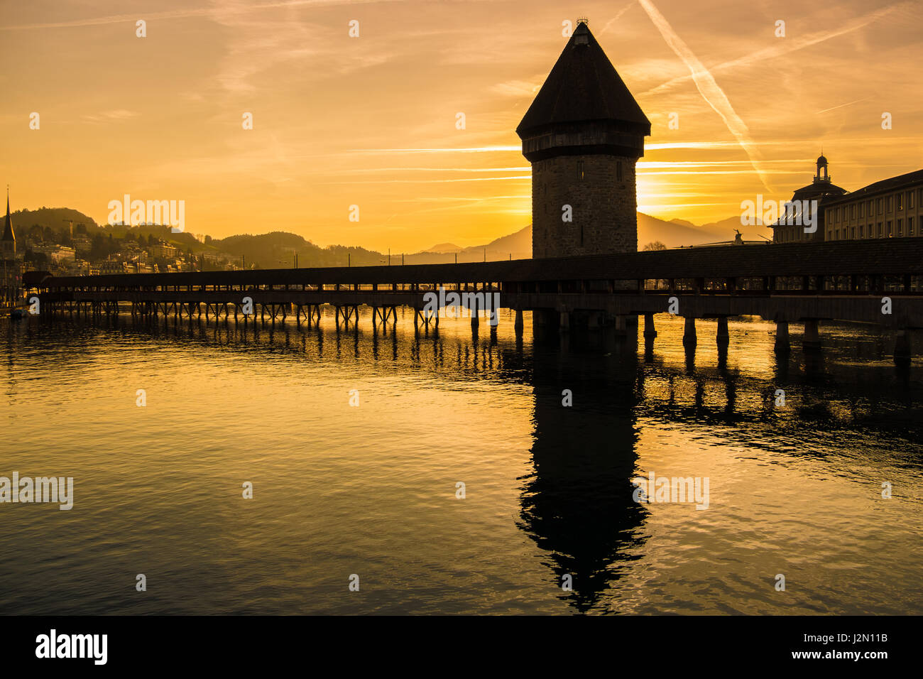 The Kapellbrücke (Chapel Bridge), a covered wooden footbridge spanning ...