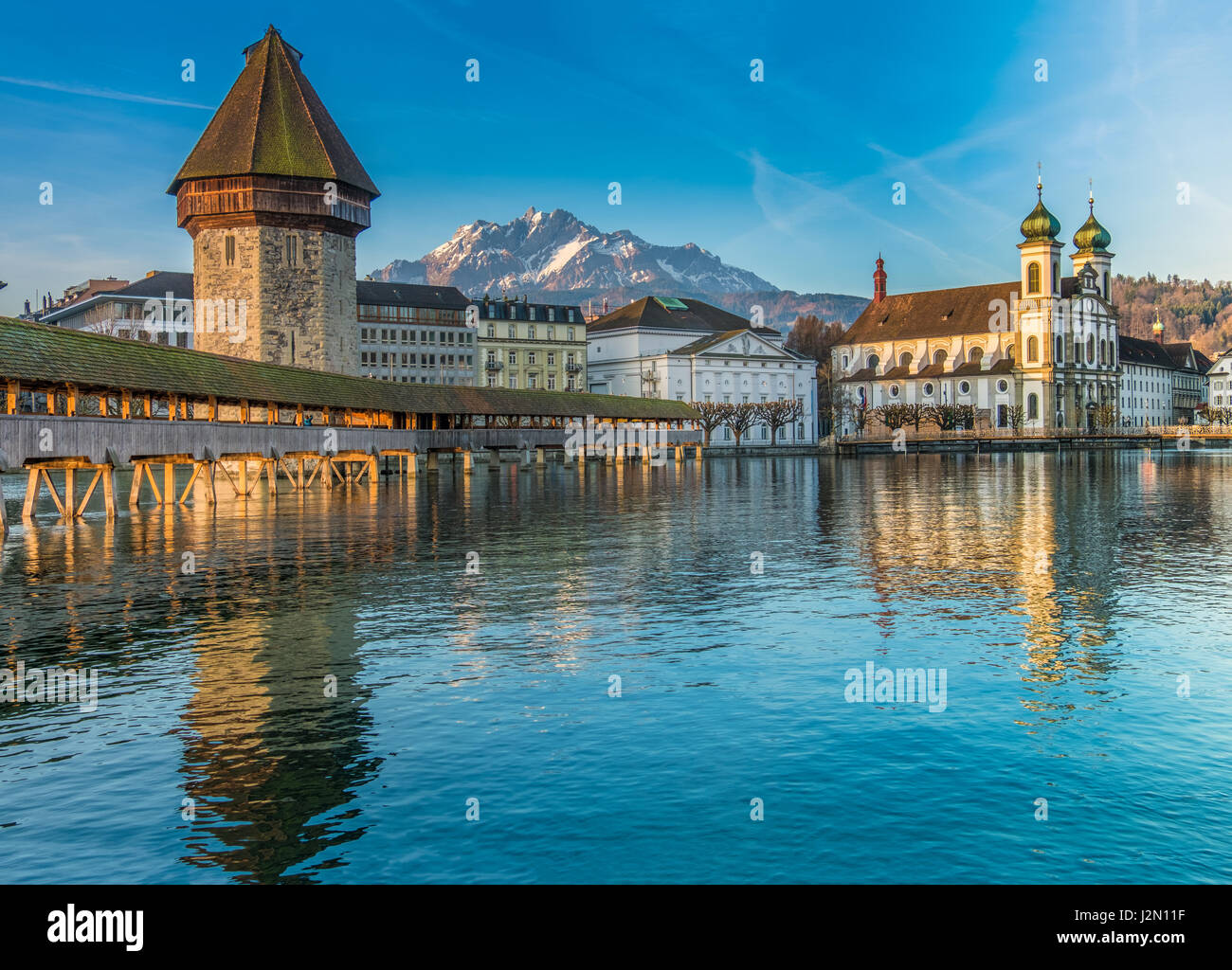 The Kapellbrücke (Chapel Bridge), a covered wooden footbridge spanning ...
