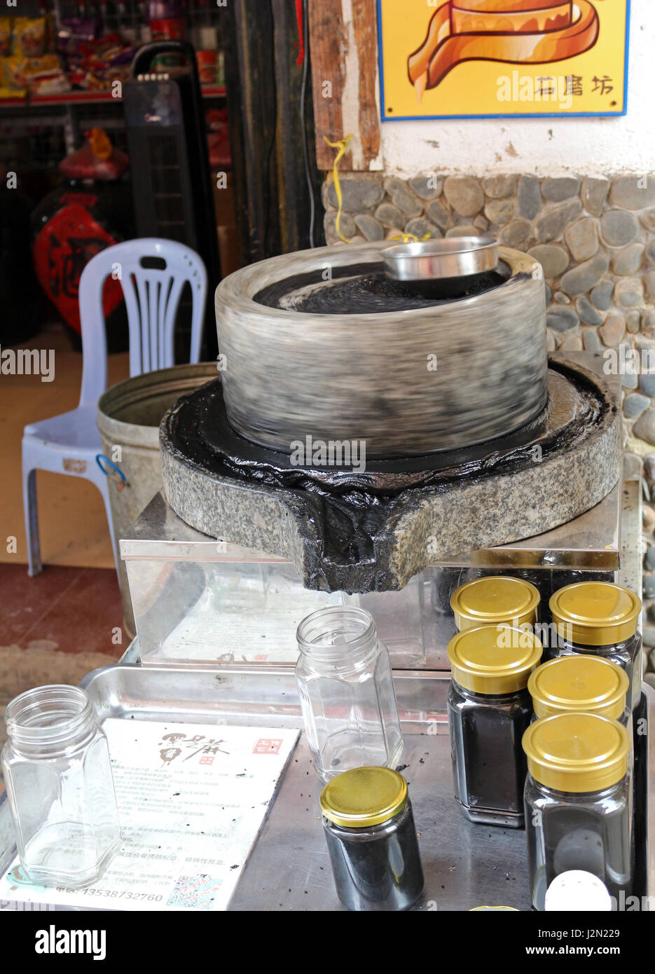 sesame mill with jars Stock Photo - Alamy