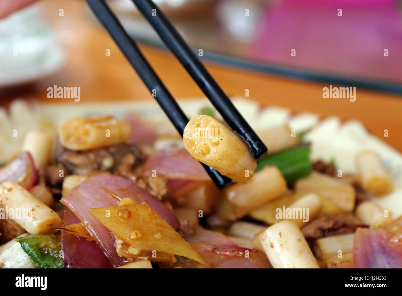 stir fried baby lotus root Stock Photo - Alamy