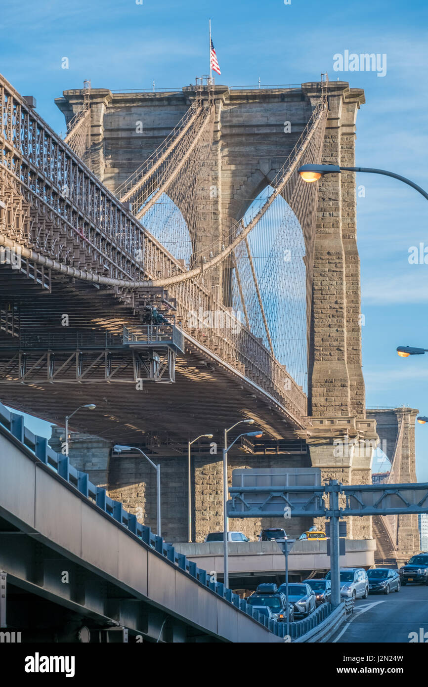 View of the Brooklyn Bridge from the street level access, New York City ...
