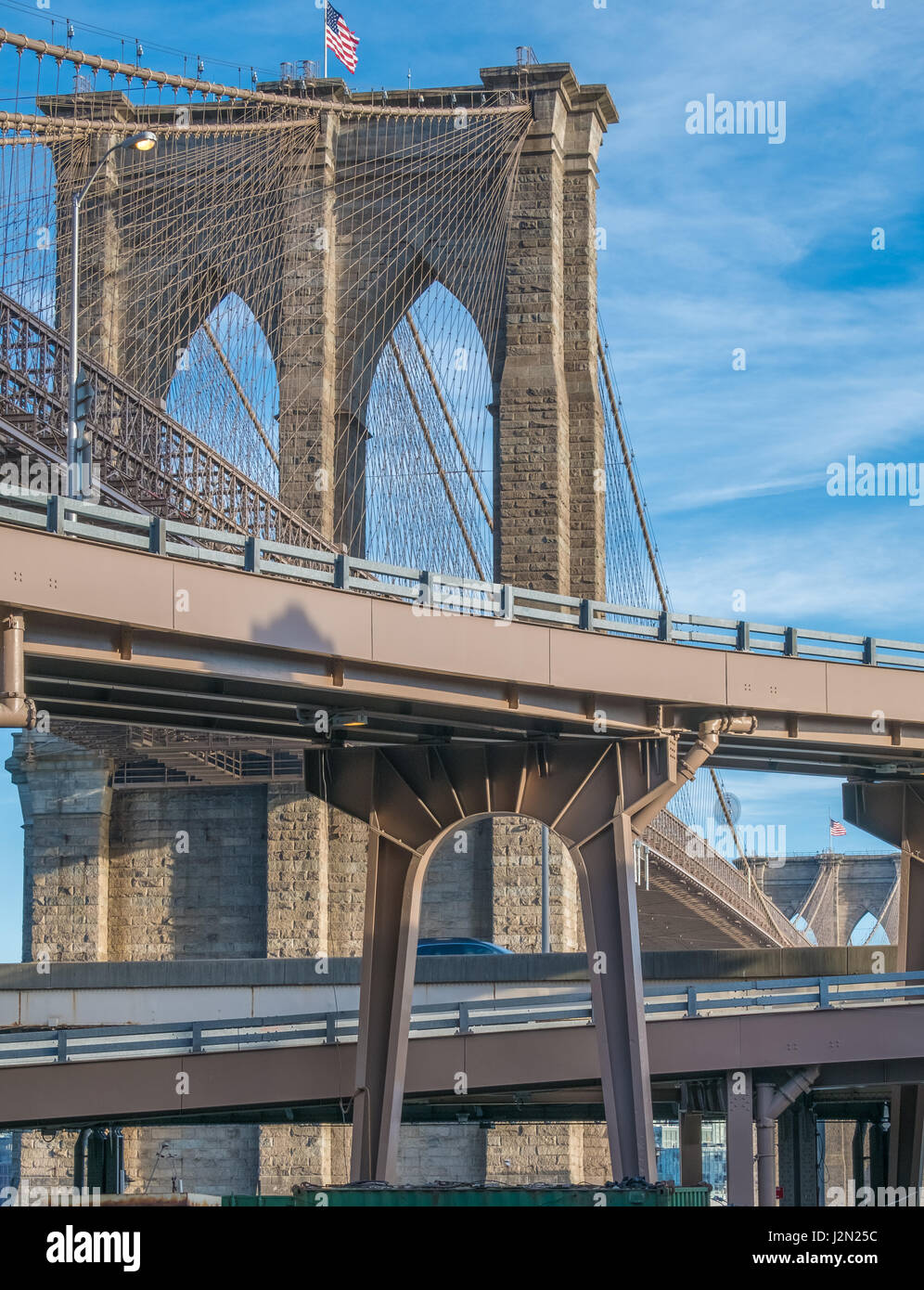 View of the Brooklyn Bridge from the street level access, New York City ...