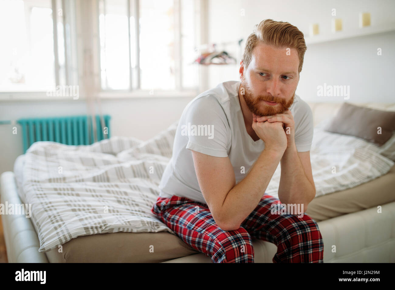 Depressed man waking up hi-res stock photography and images - Alamy