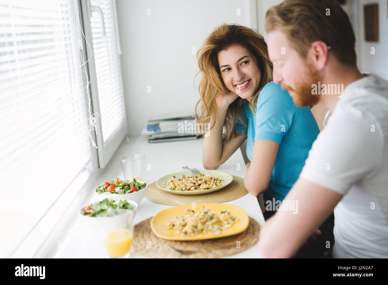 Romantic couple in love having breakfast at home Stock Photo - Alamy