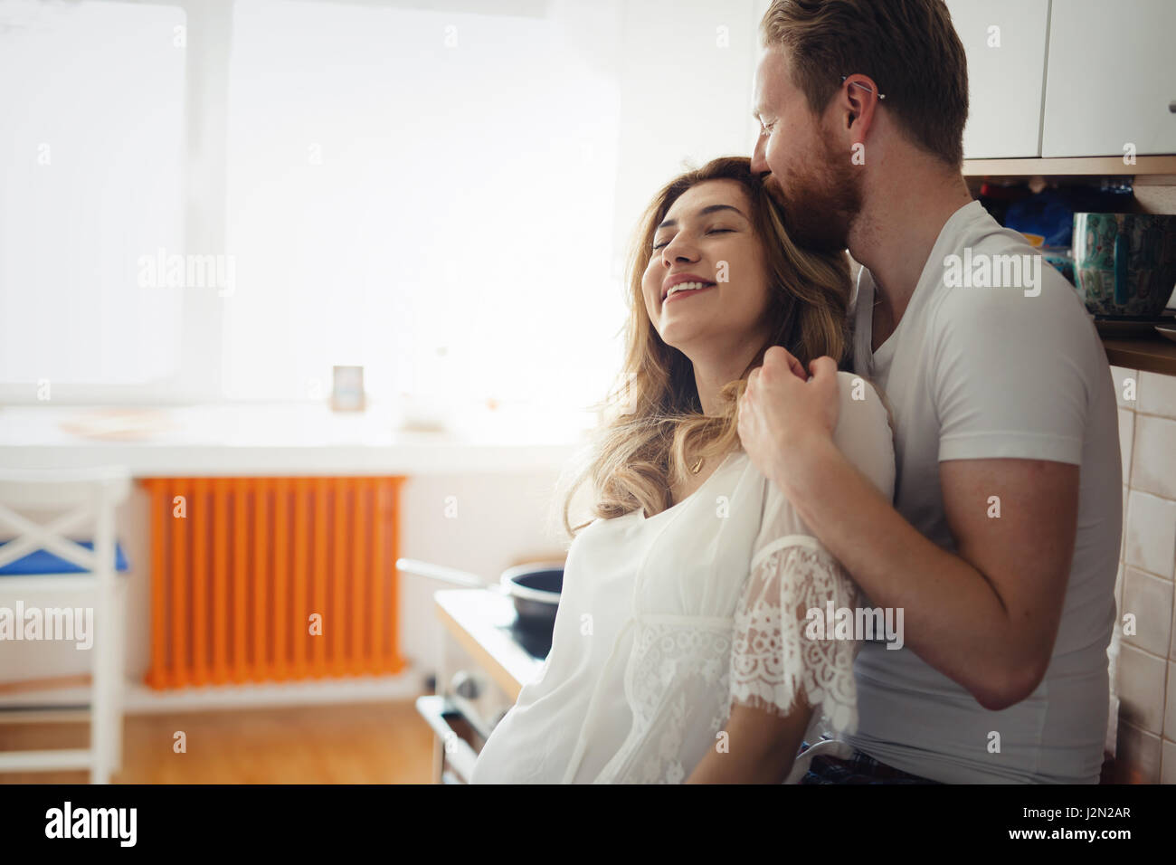 Romantic couple in love speding time together in kitchen Stock Photo ...