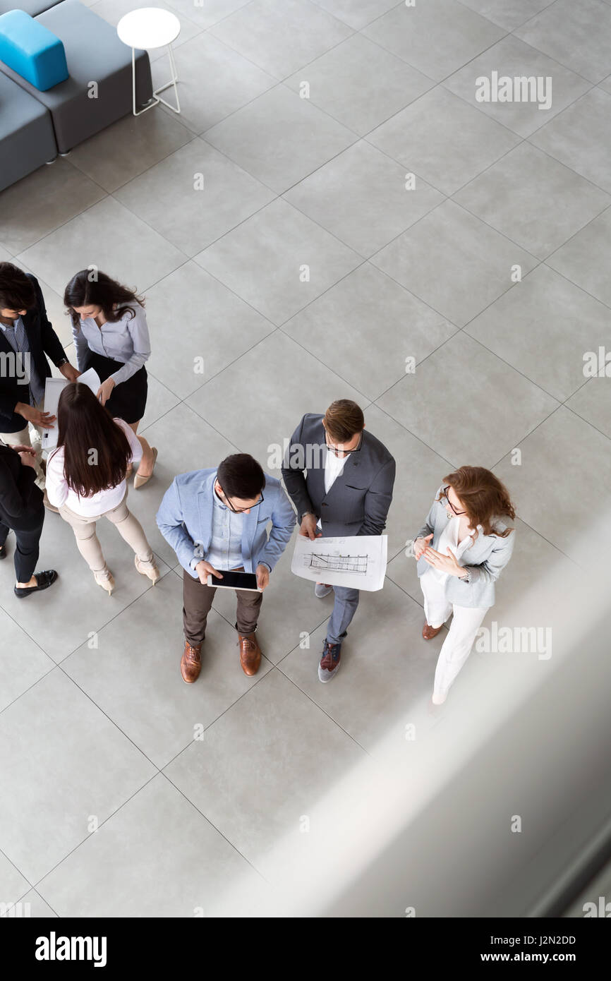 Group of business people collaborating on project in business office ...