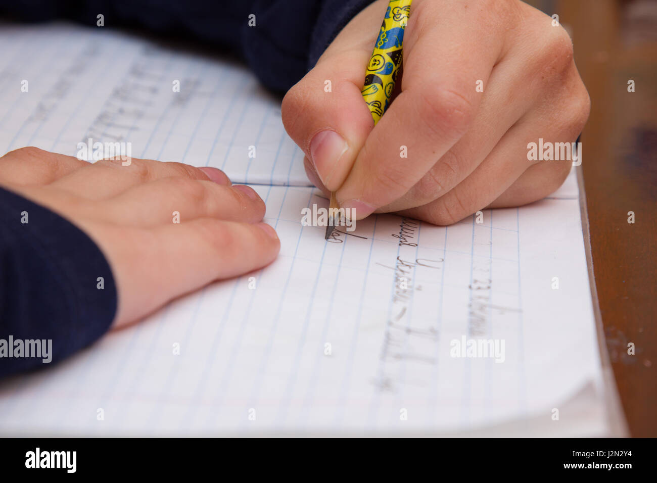Little girl is doing his homework for elementary school Stock Photo - Alamy