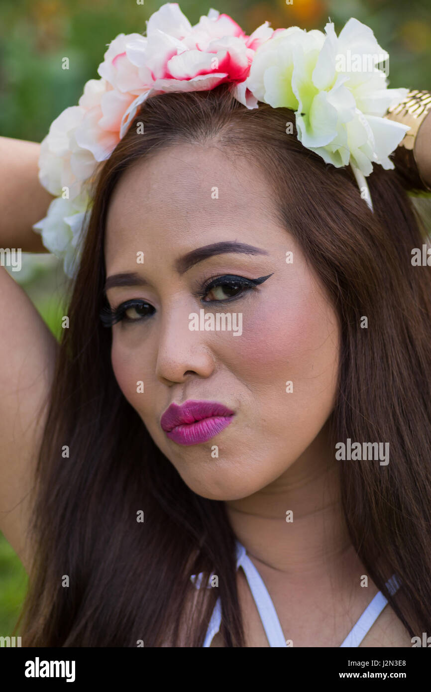 Filipino model southeast asian beauty with a local park as a backdrop ...