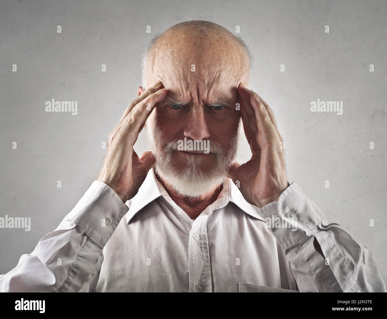 Old man with headache Stock Photo - Alamy